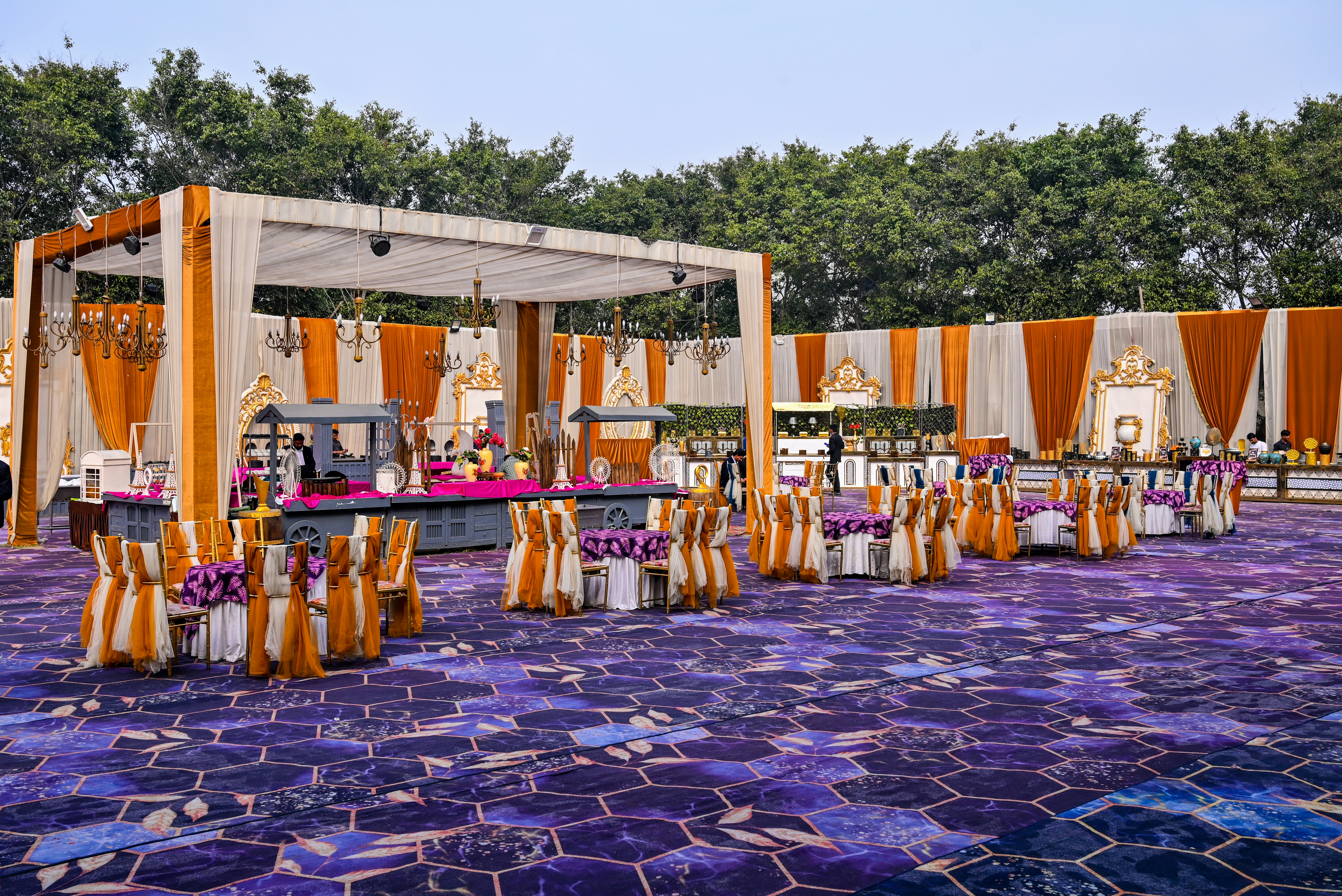 An outdoor event set up with chairs and tables. photo – Free India ...