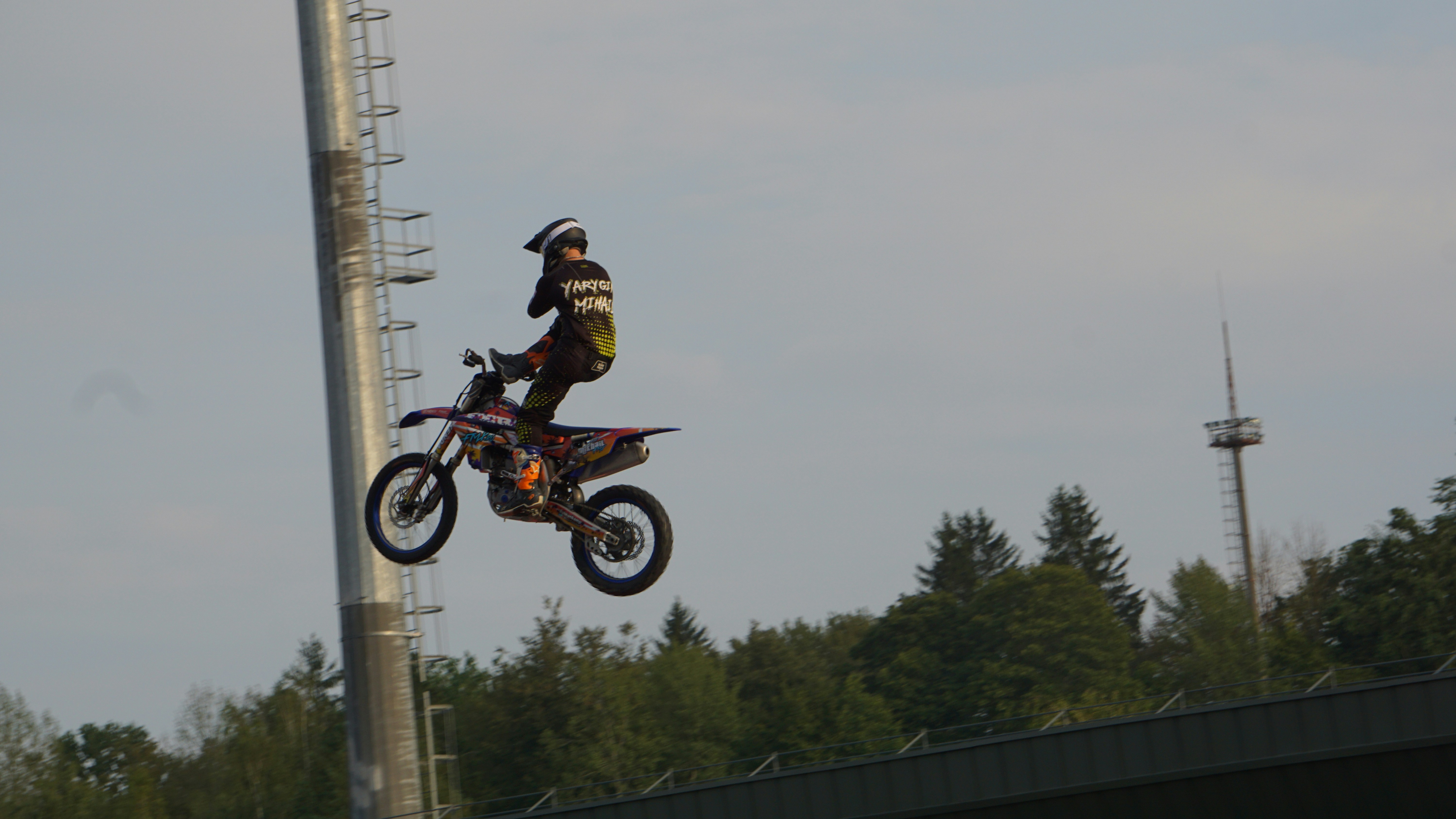 A motocross rider does a jump in mid-air. photo – Free Bike Image on ...
