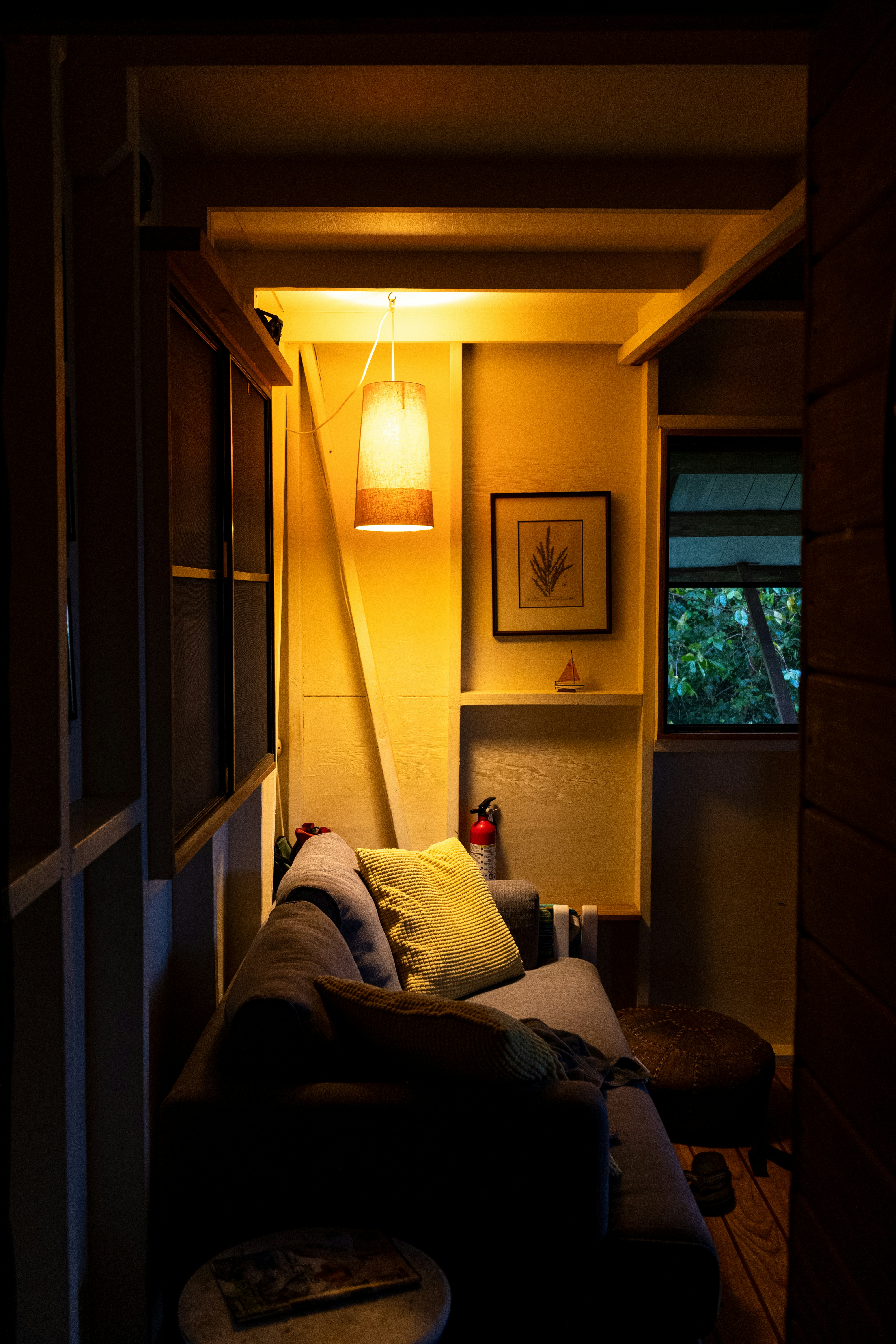 Amber Pendant Glow in a Narrow Living Nook: A Cozy Corner Bathed in Golden Light