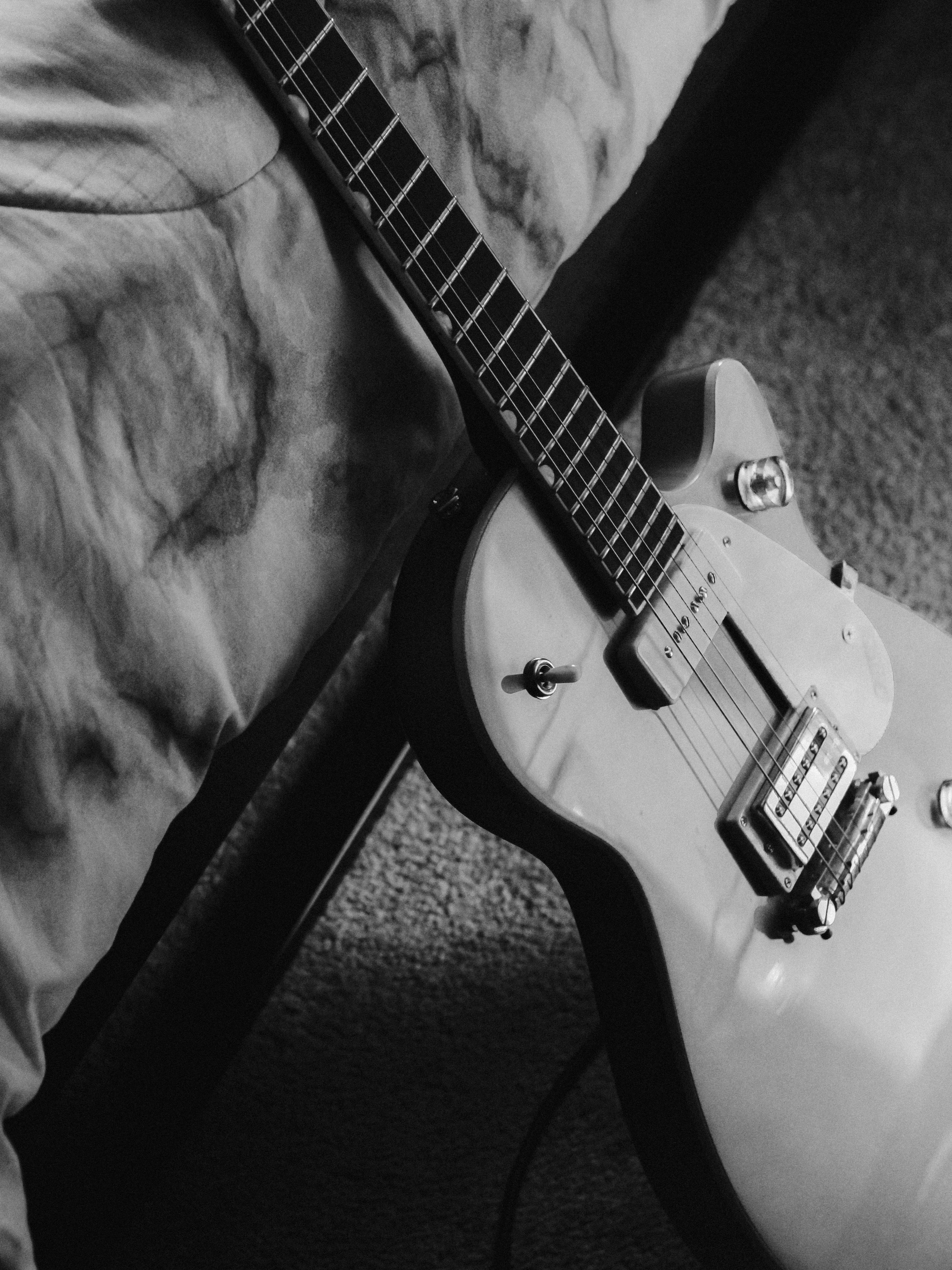 Strings and Shadows: A Guitar's Contemplative Moment