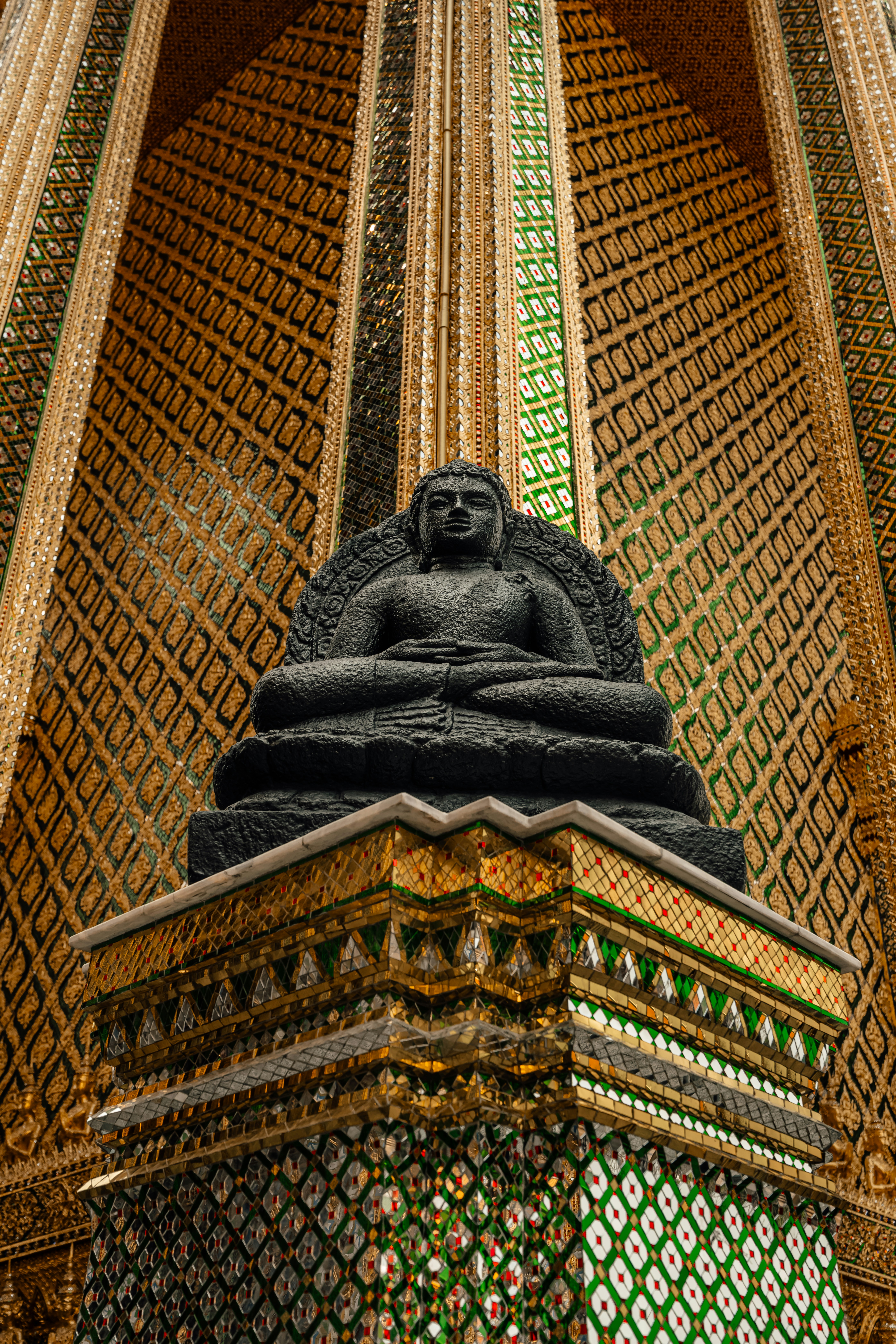 Buddha on a Jade-Tiled Pedestal Amid Golden Temple Tiers