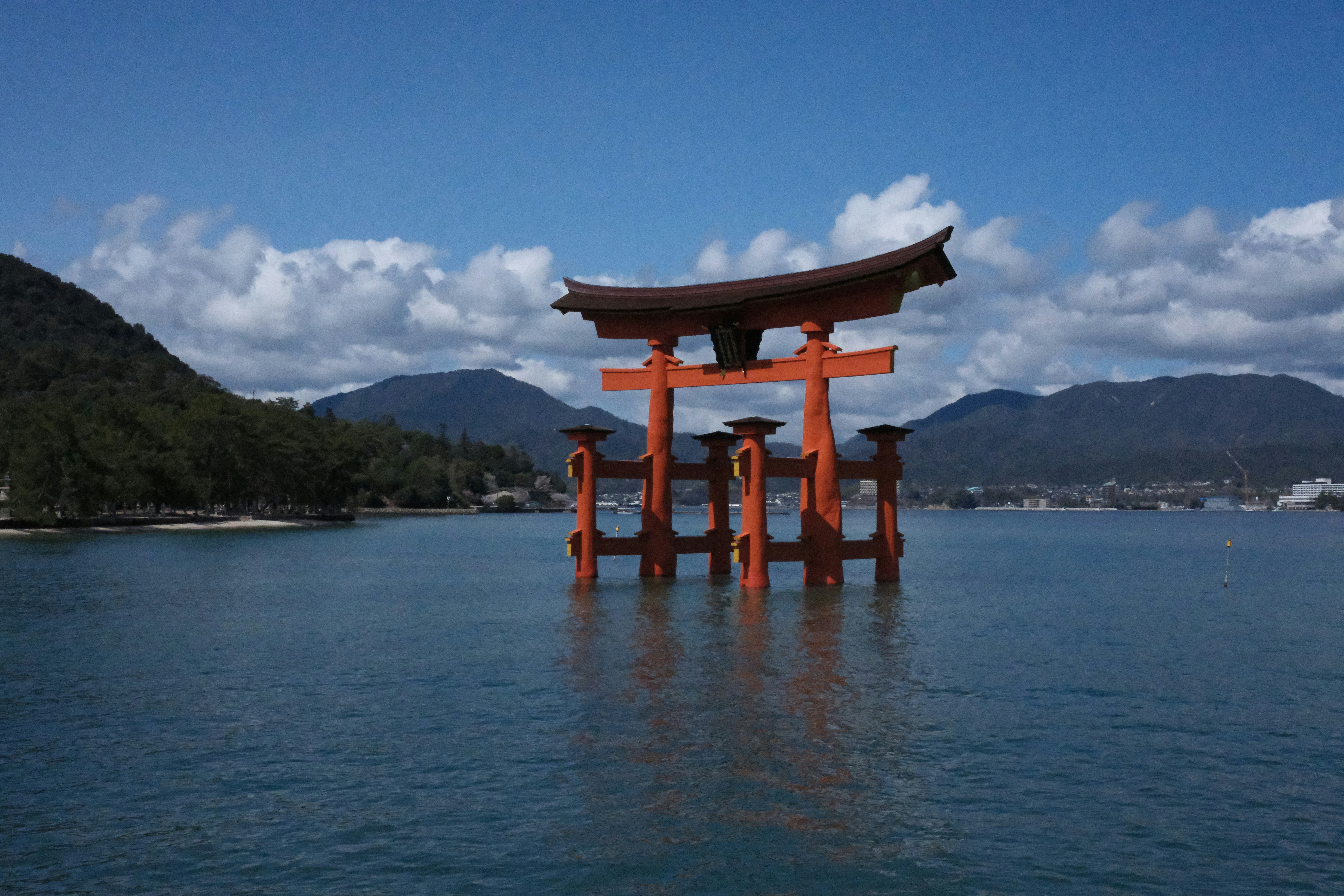The iconic floating torii gate stands in the ocean. photo – Free Image ...