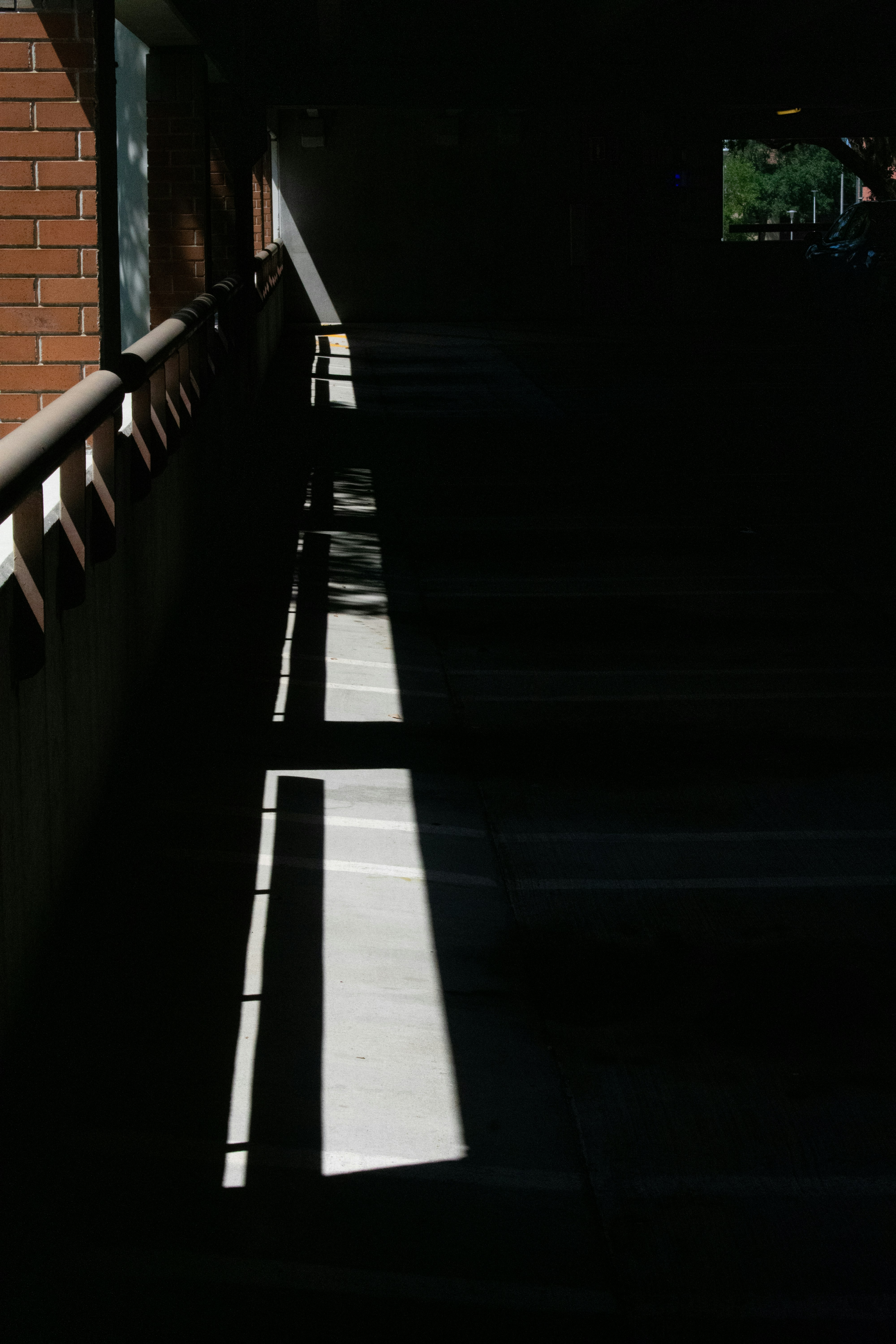 Shadows create geometric shapes in the dim corridor. photo – Free Light ...
