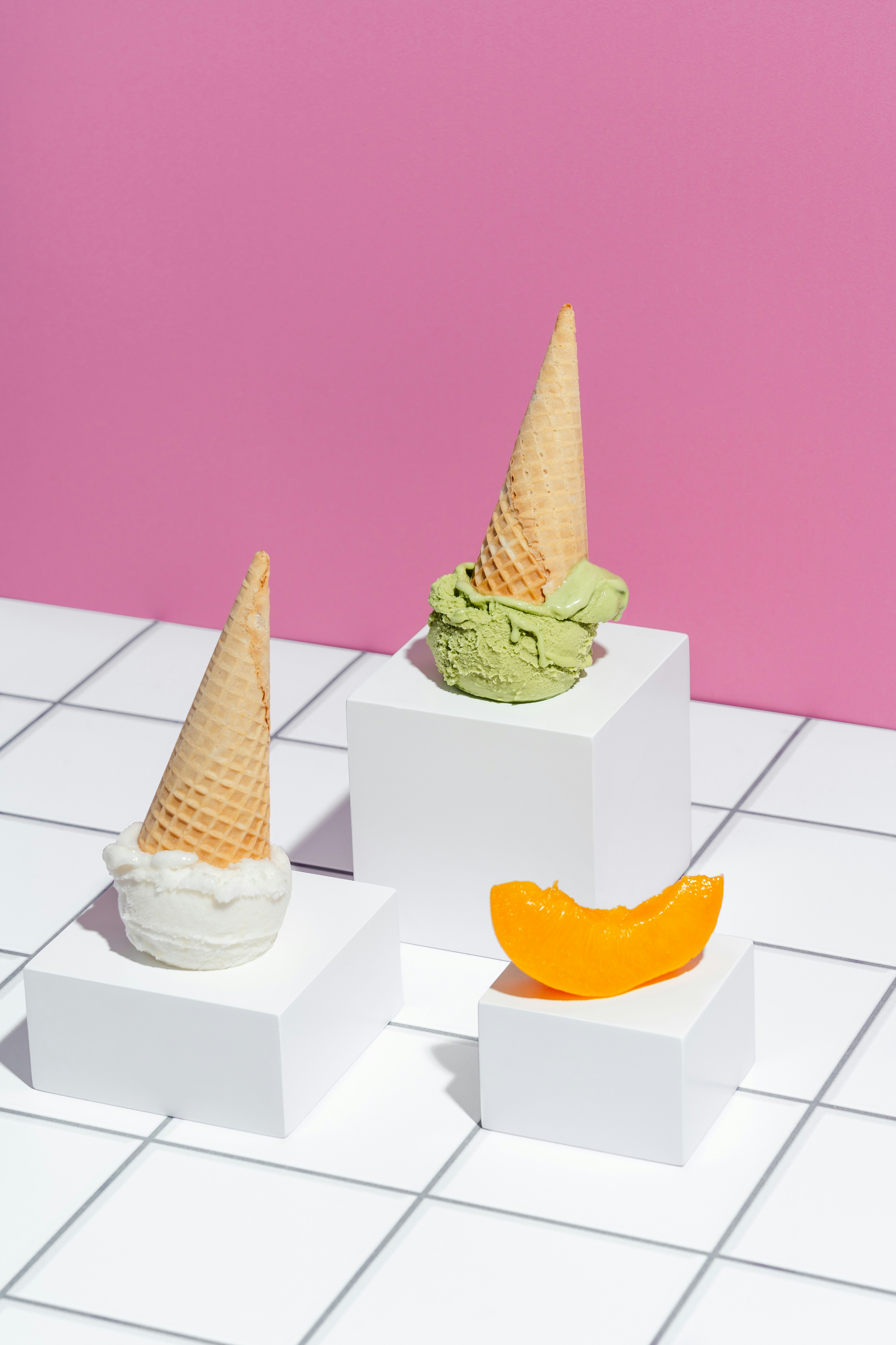 Pastel Cones on White Pedestals: A Minimal Ice-Cream Tableau in Pink