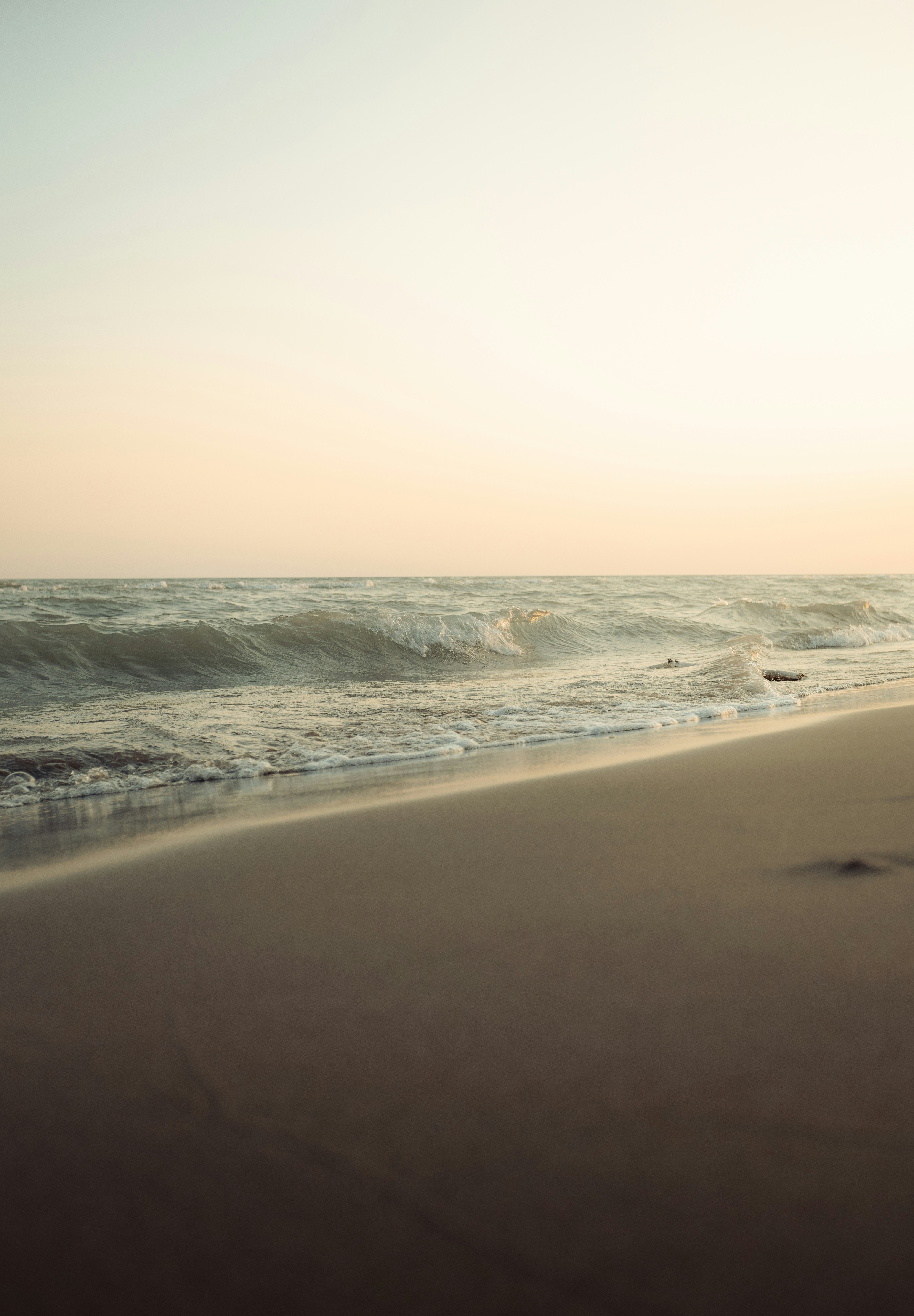 Pastel Tide: A Quiet Beachscape at Dusk