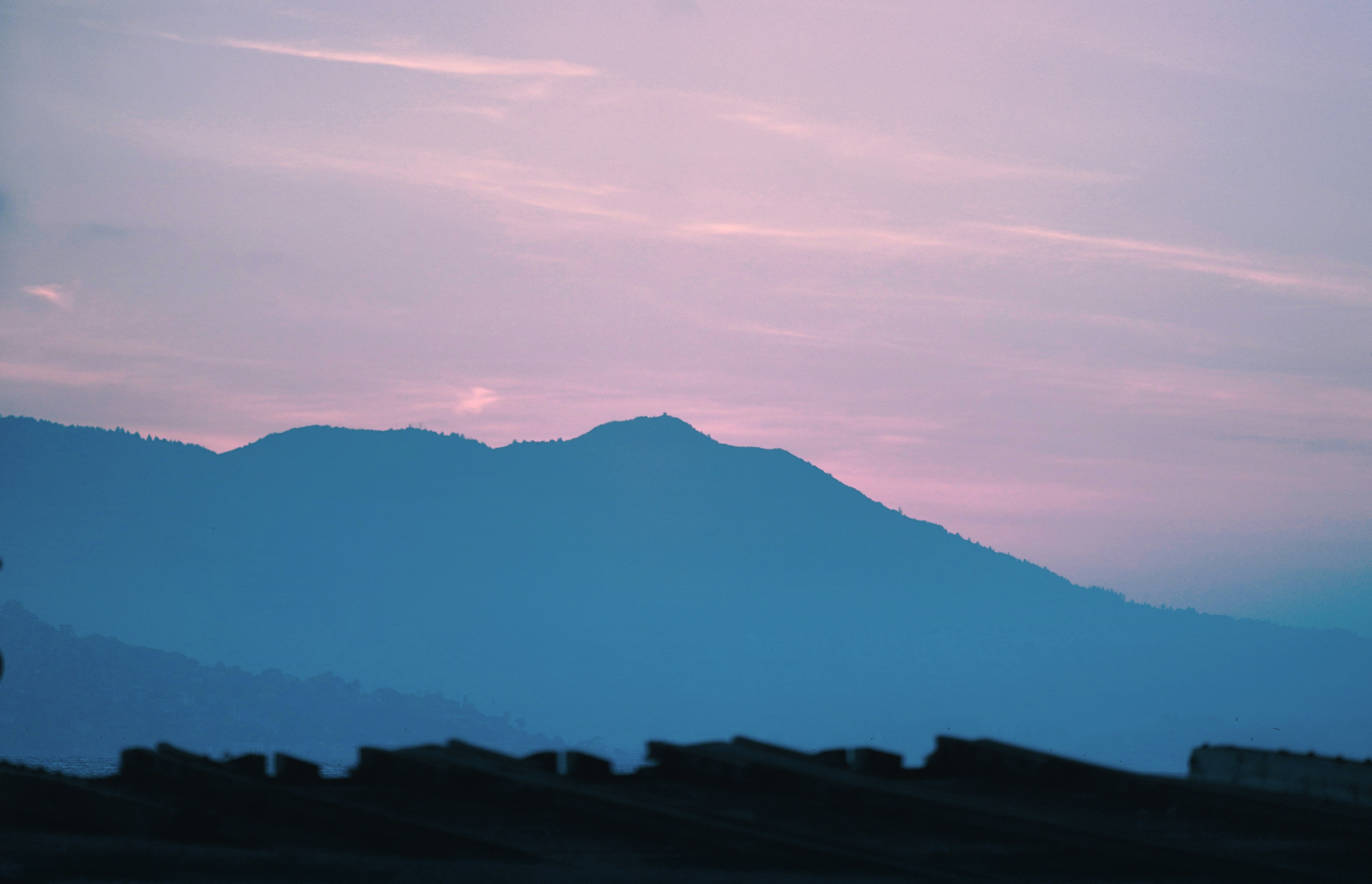 Blue Hour Ridge Over a Quiet Rooftop