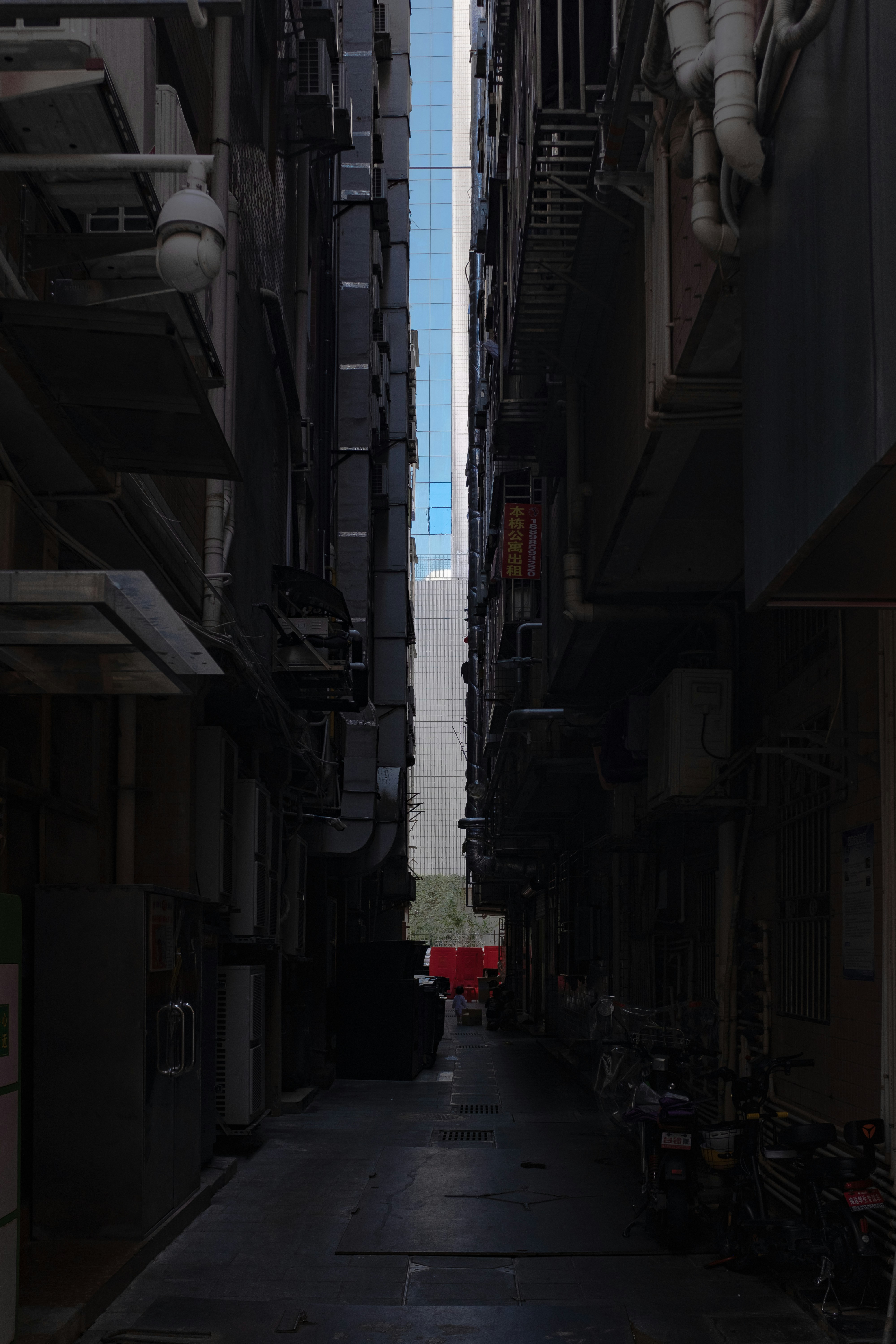 Alleyway between buildings reveals a glimpse of sky. photo – Free China ...