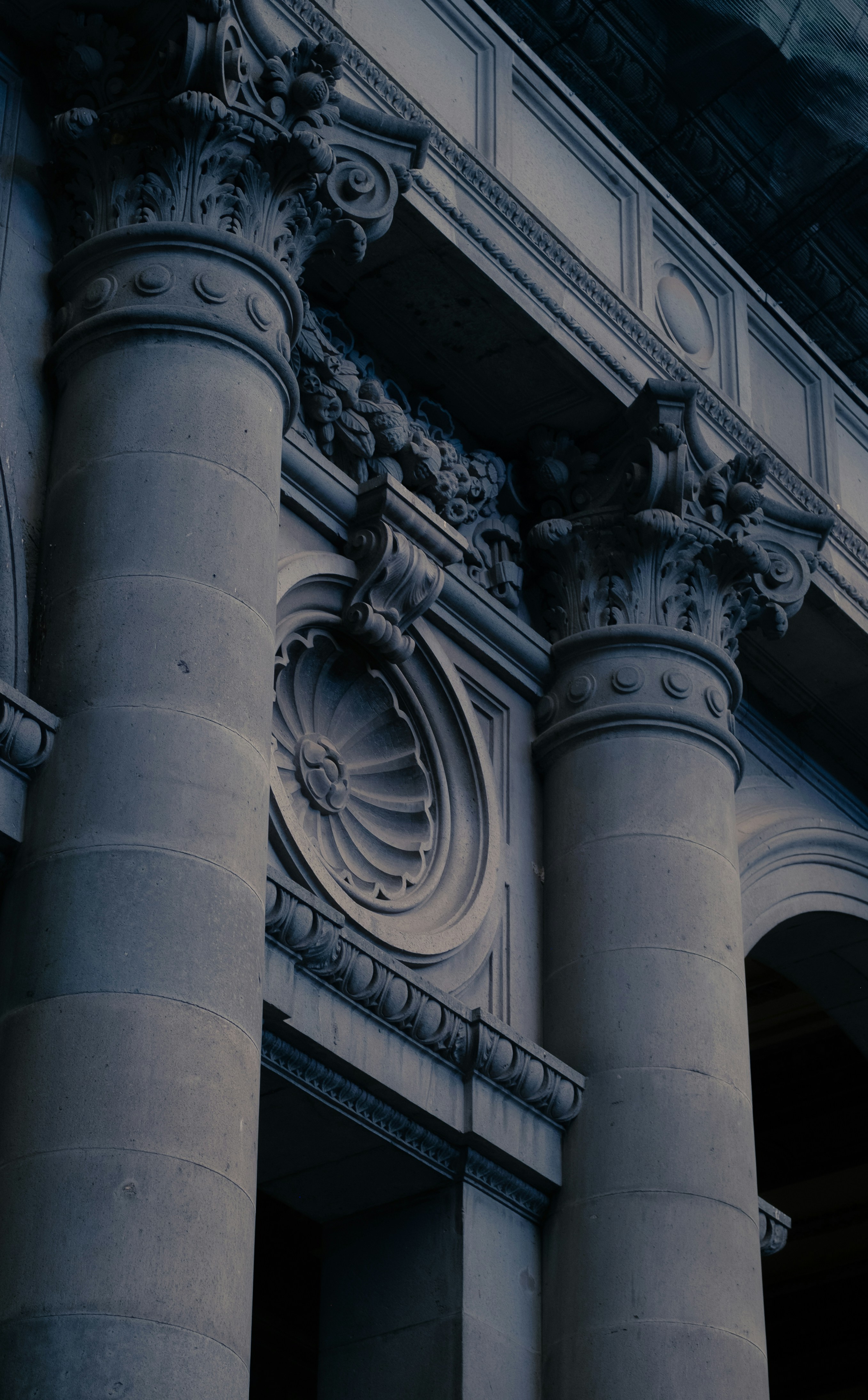 Detailed architecture features two pillars and a sculpted wall. photo ...