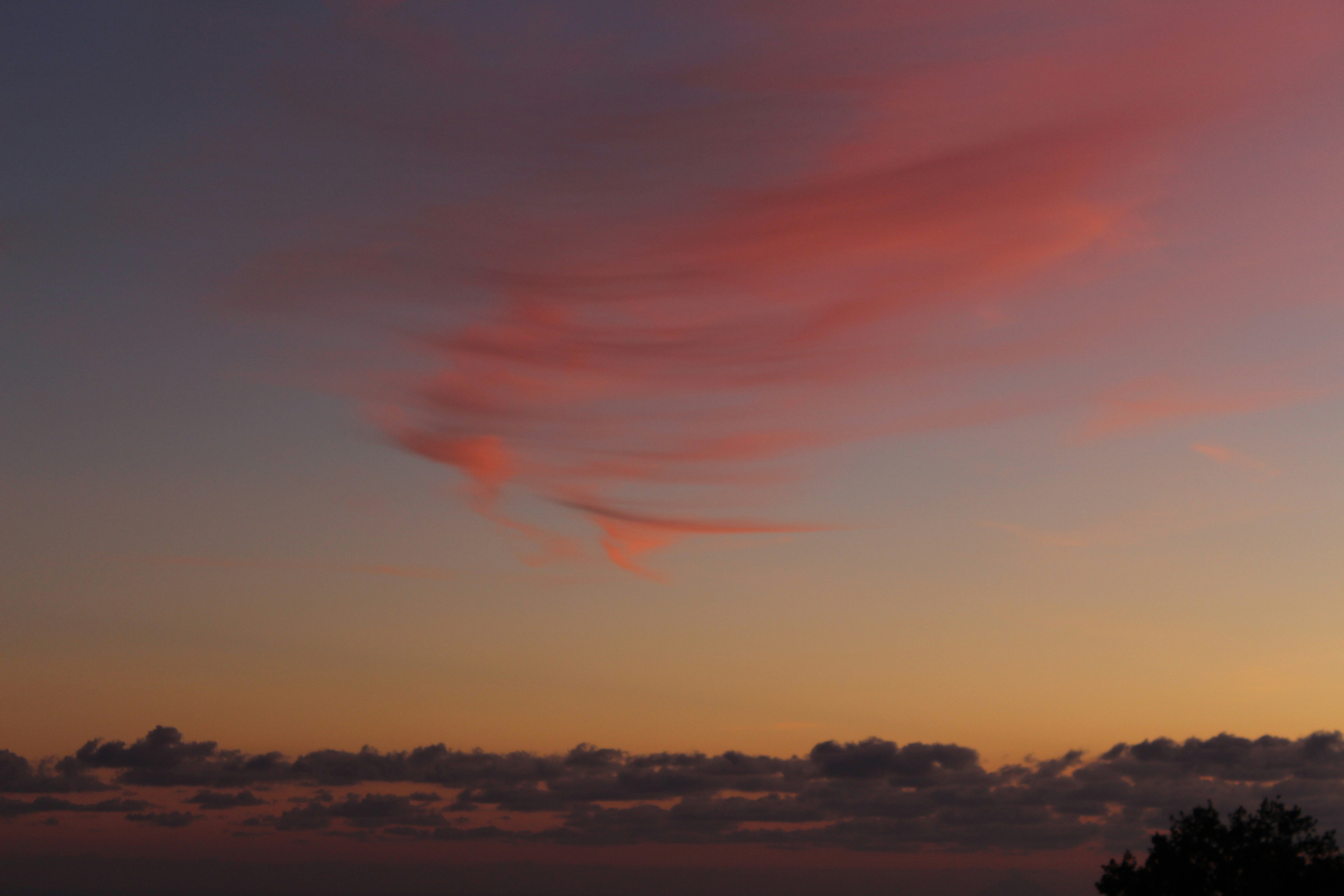 Crimson Arc Over a Quiet Dusk Horizon