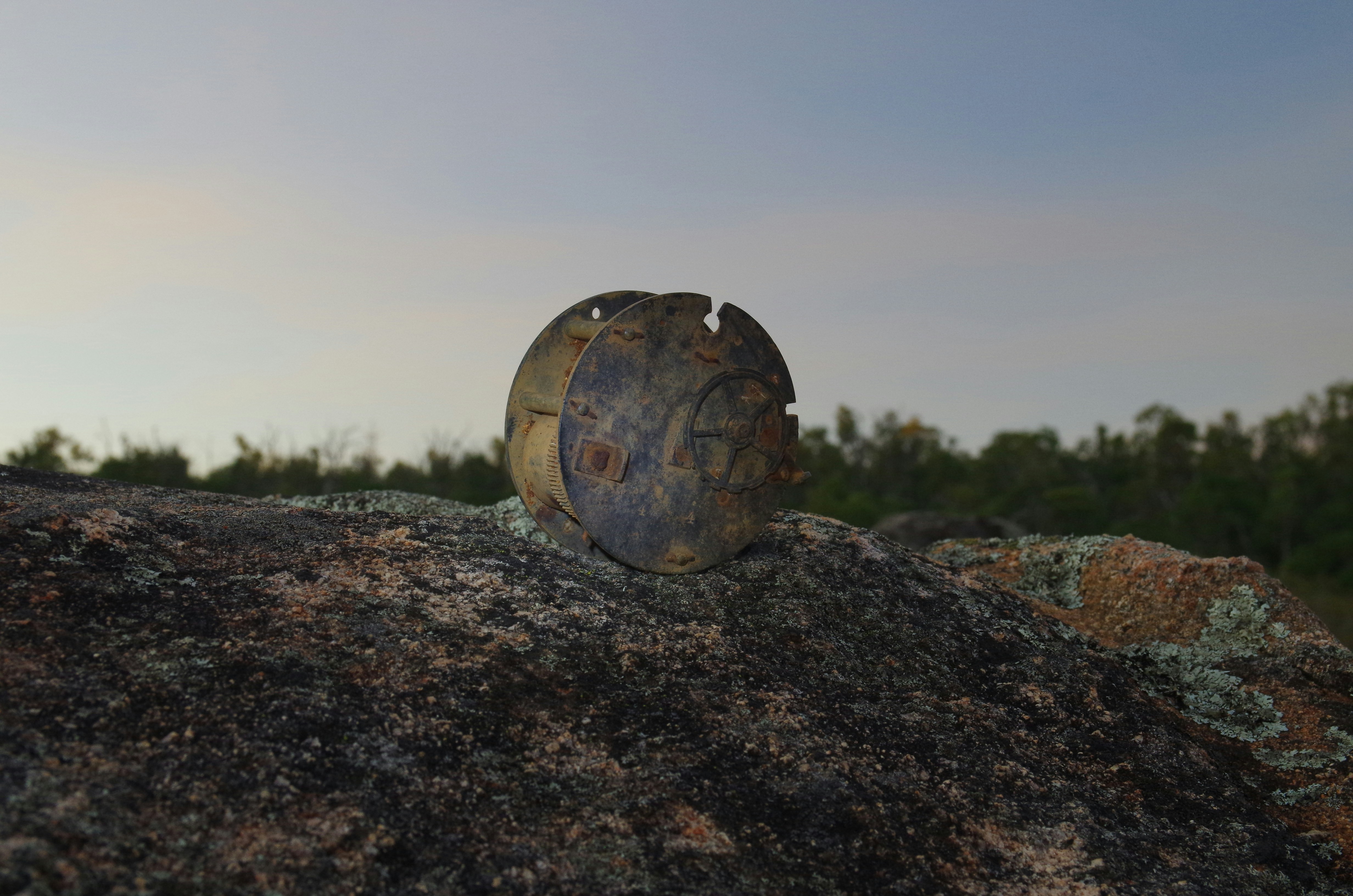 Patinaed Disk on Weathered Granite at Dusk