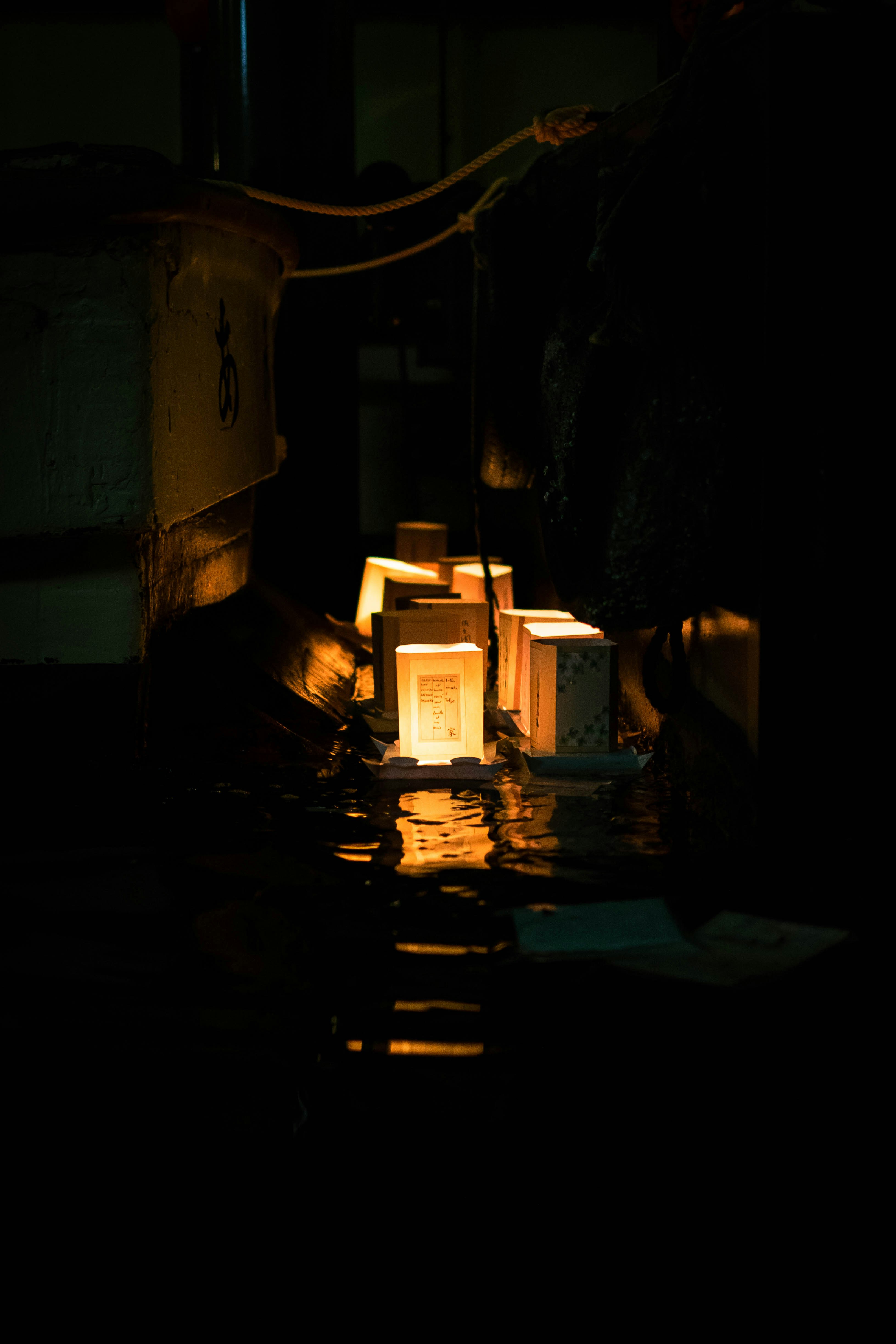 Glowing metal blocks are illuminated in a dark factory. photo – Free ...