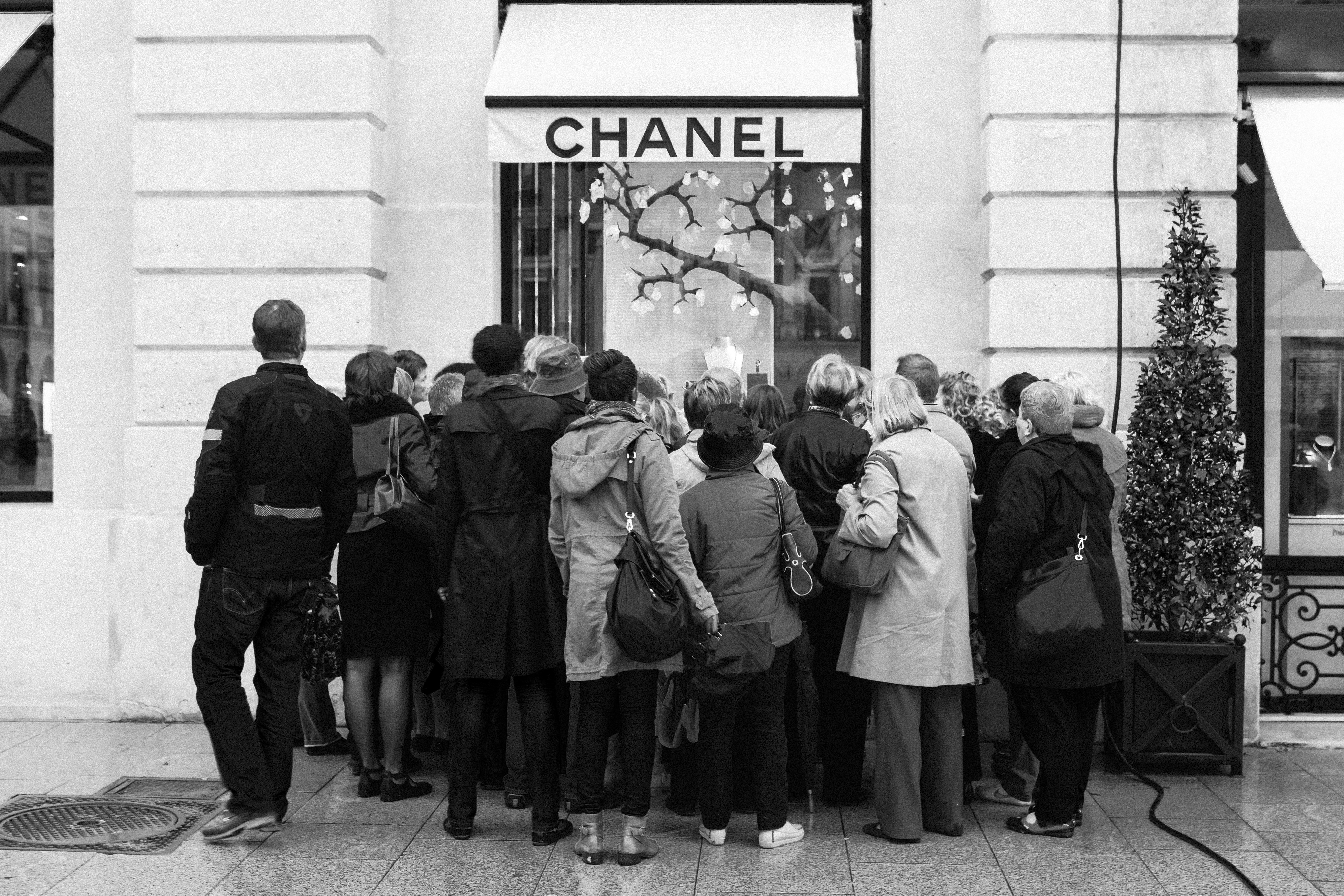People gather to look at the chanel store. photo – Free Black Image on ...