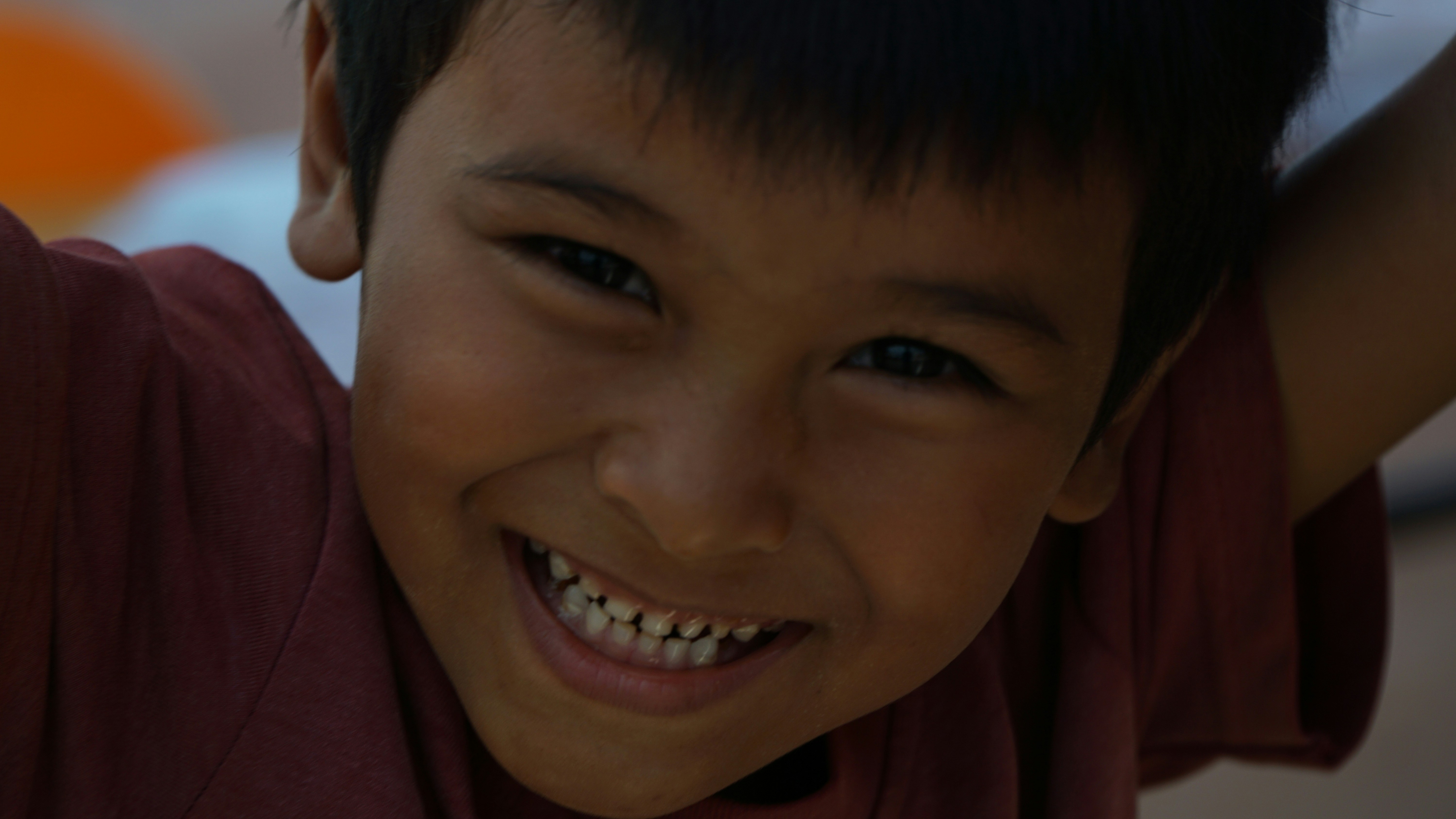 A happy child smiles widely at the camera. photo – Free Image on Unsplash