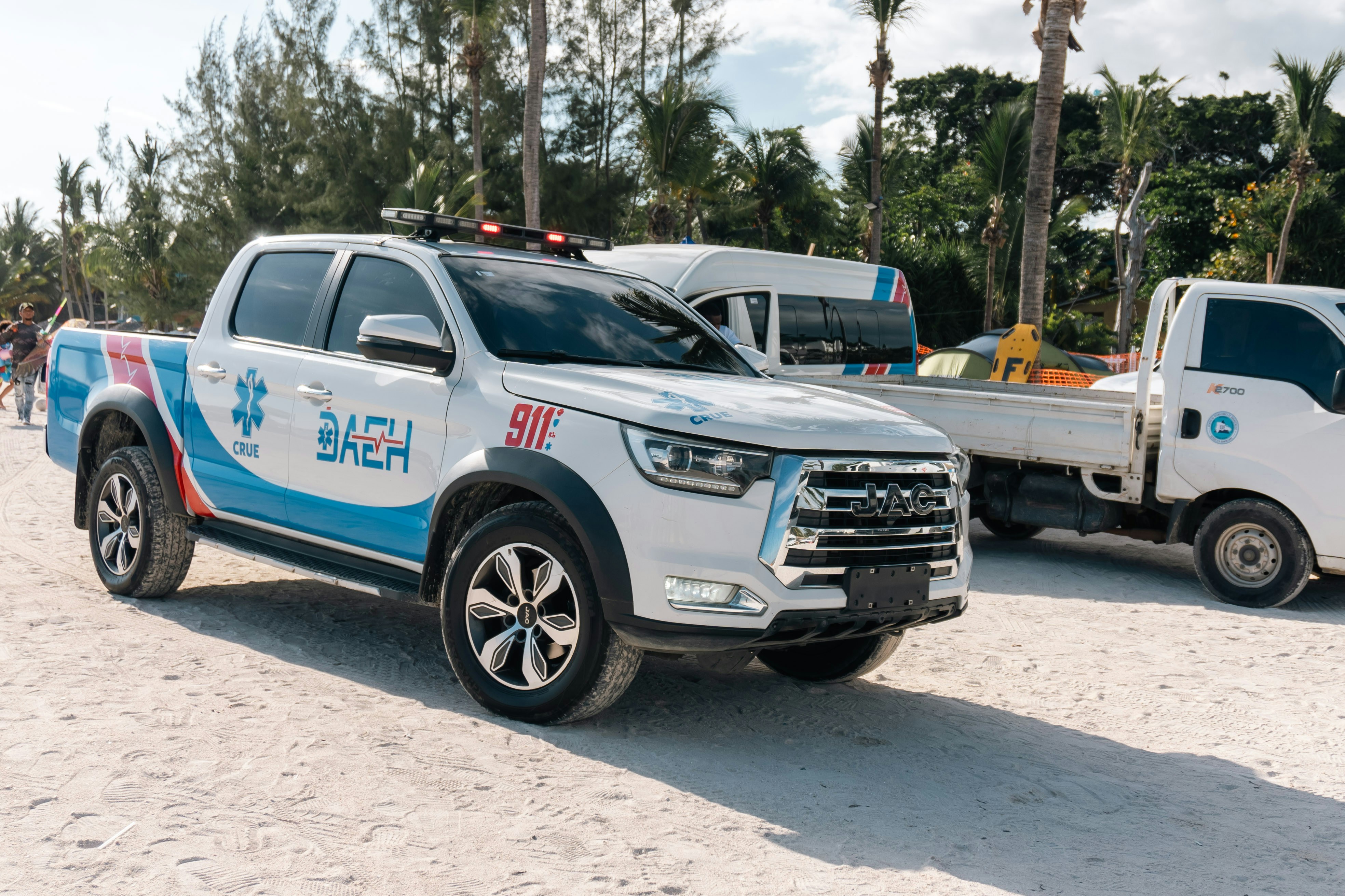 Emergency Ride: Aazure EMS Pickup Anchors a Beachfront Scene