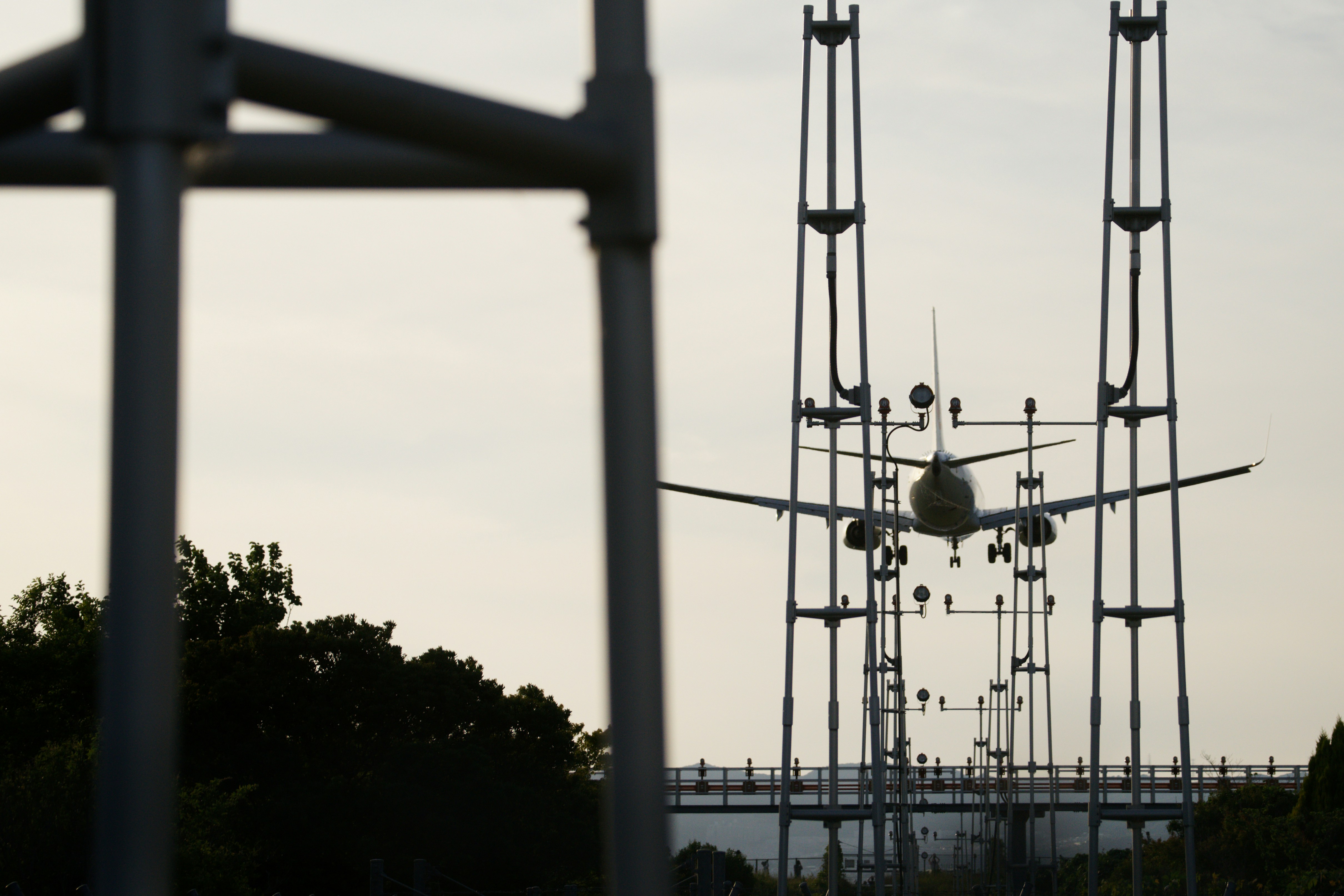 Approaching Landing: A Narrow Corridor of Jet Blues and Steel
