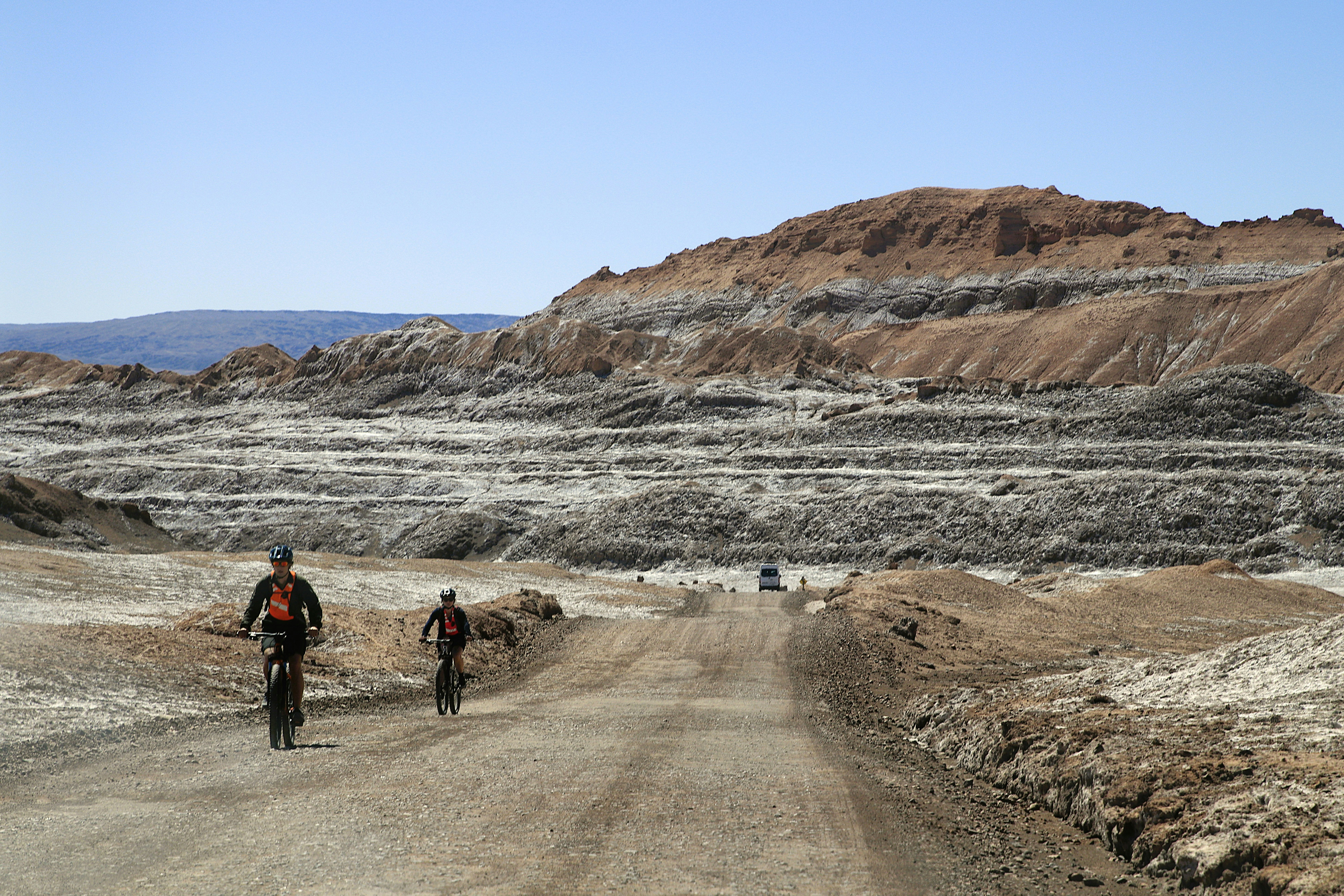 Dusty Rim Trail: Cyclists Carve a Path Through Striated Badlands