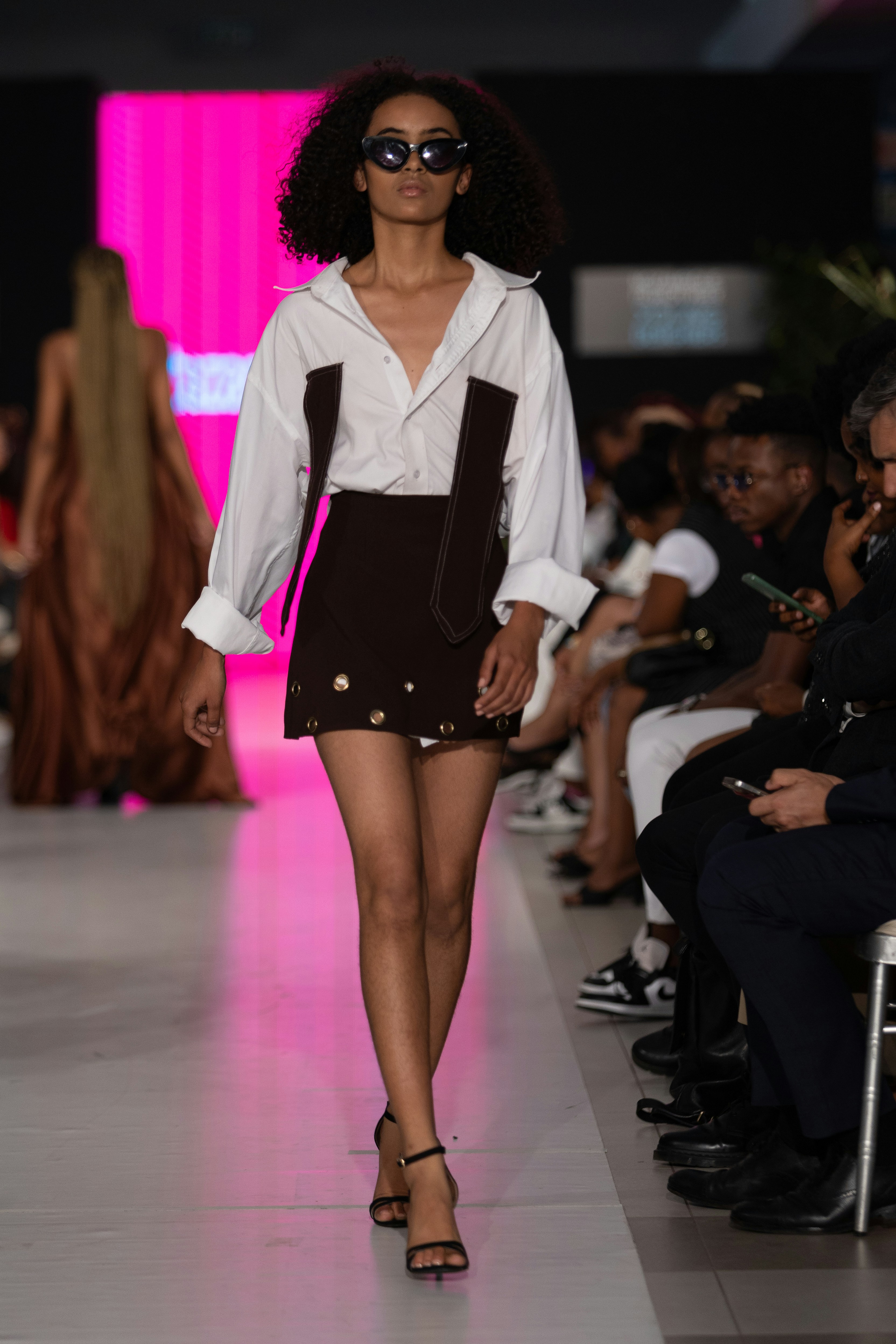 A model walks the runway in designer clothing. photo – Free Fashion ...