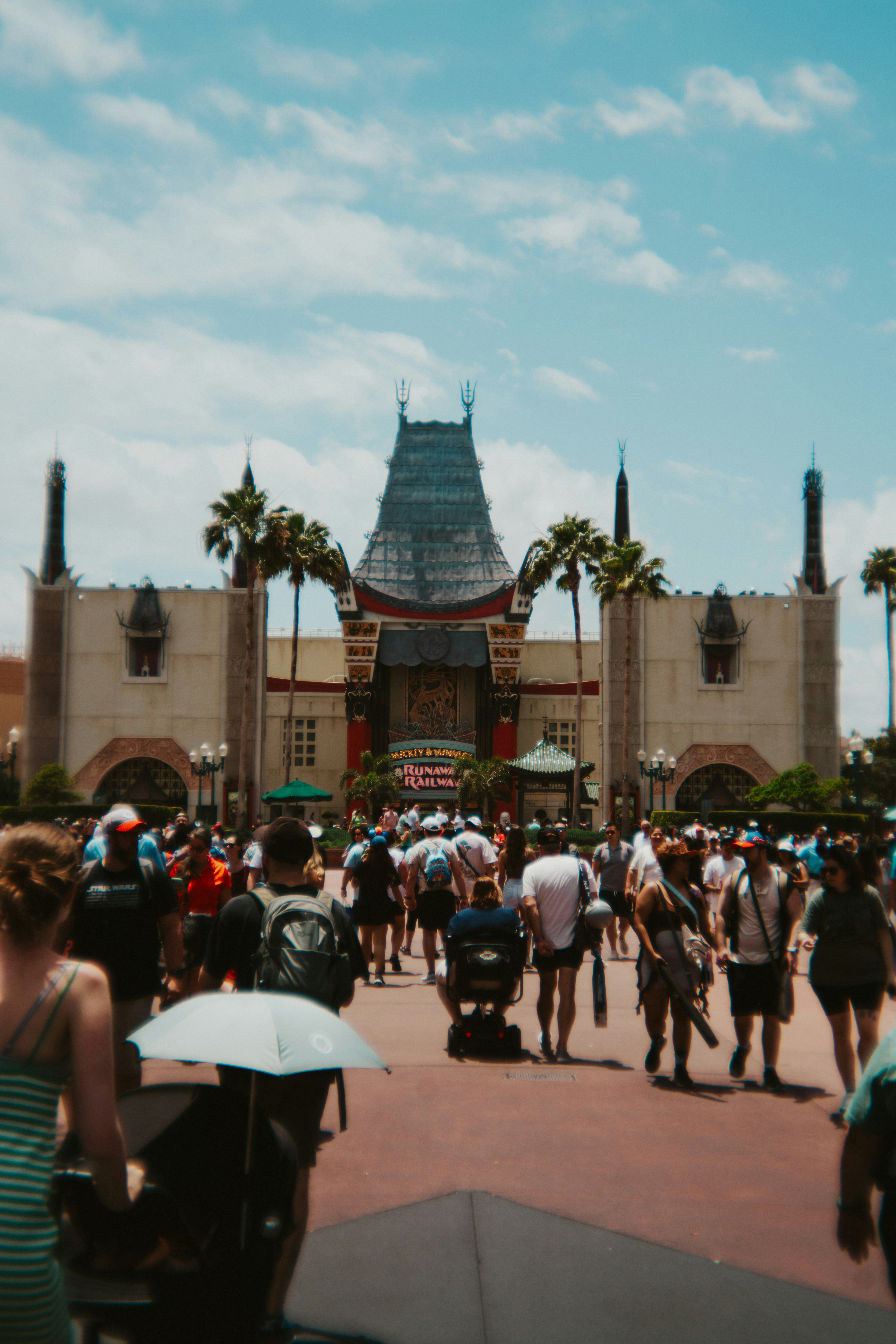 Murmur of the Plaza: A Theme Park Crowd at the Entrance Gate
