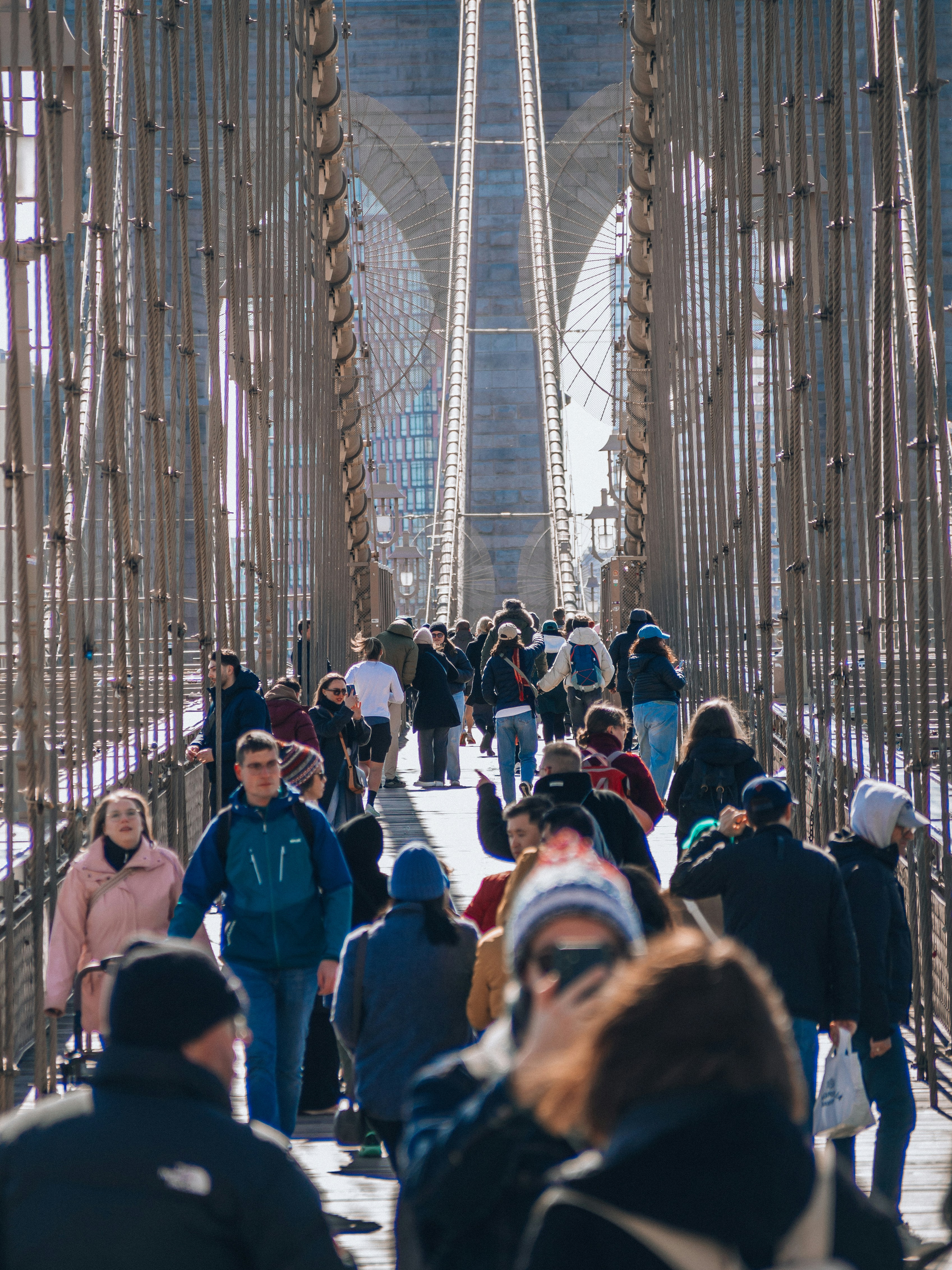 Bridge Passage: A Sea of People Crossing a Cables-and-Arches Span