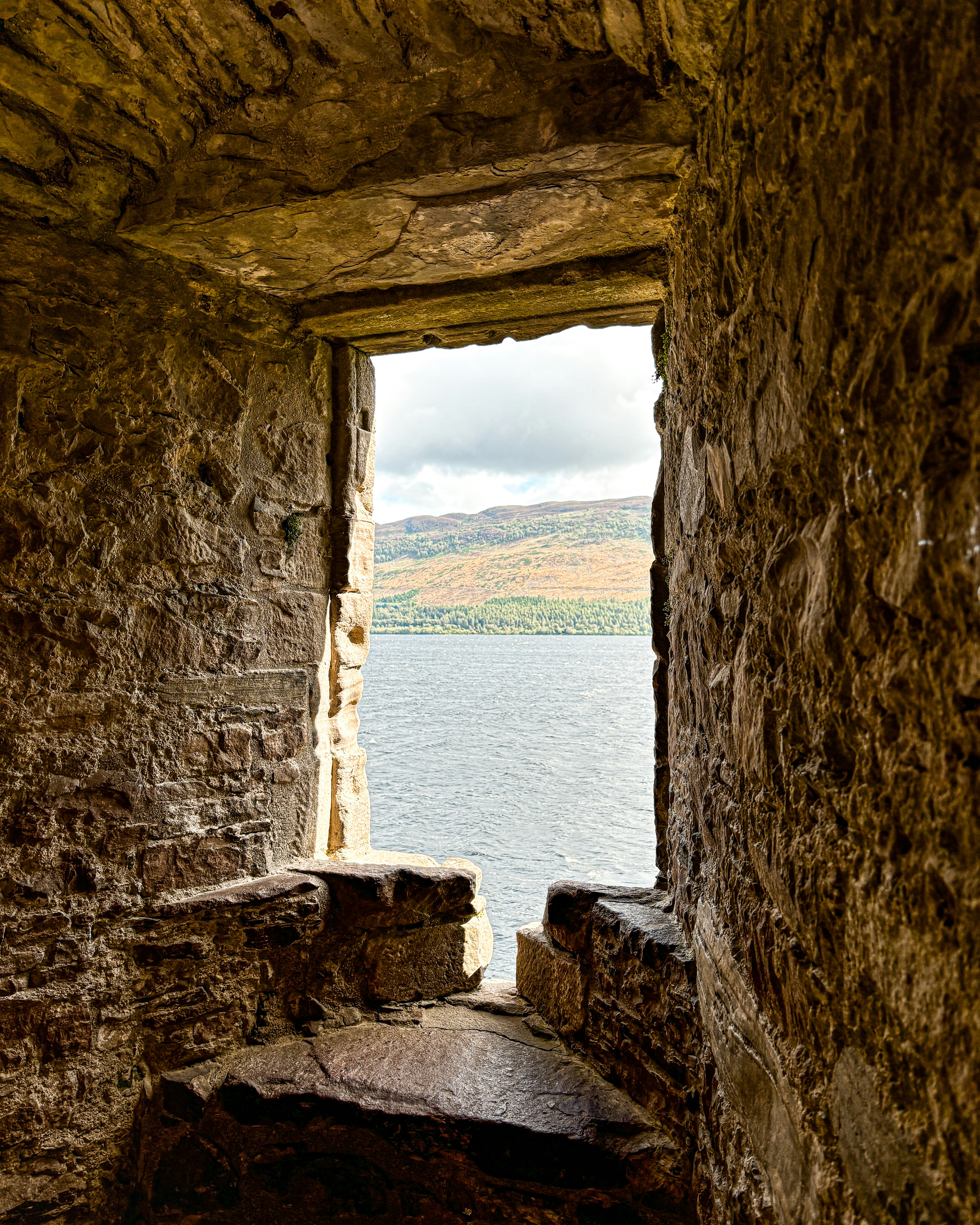 Hidden Window to the Lake: A Stone Colonnade Framing Nature