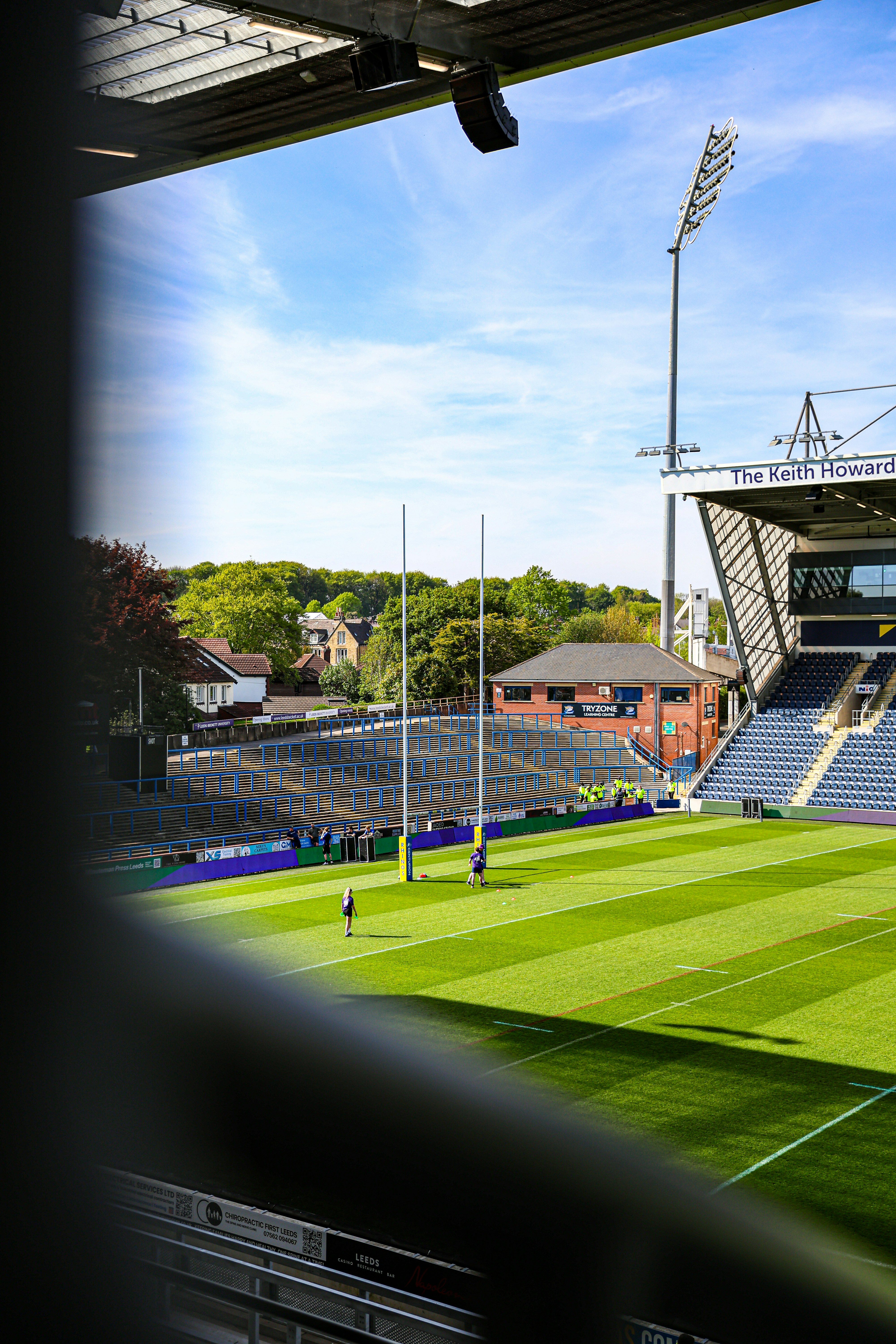 Afternoon Light on Rugby Posts in an Idle Stadium