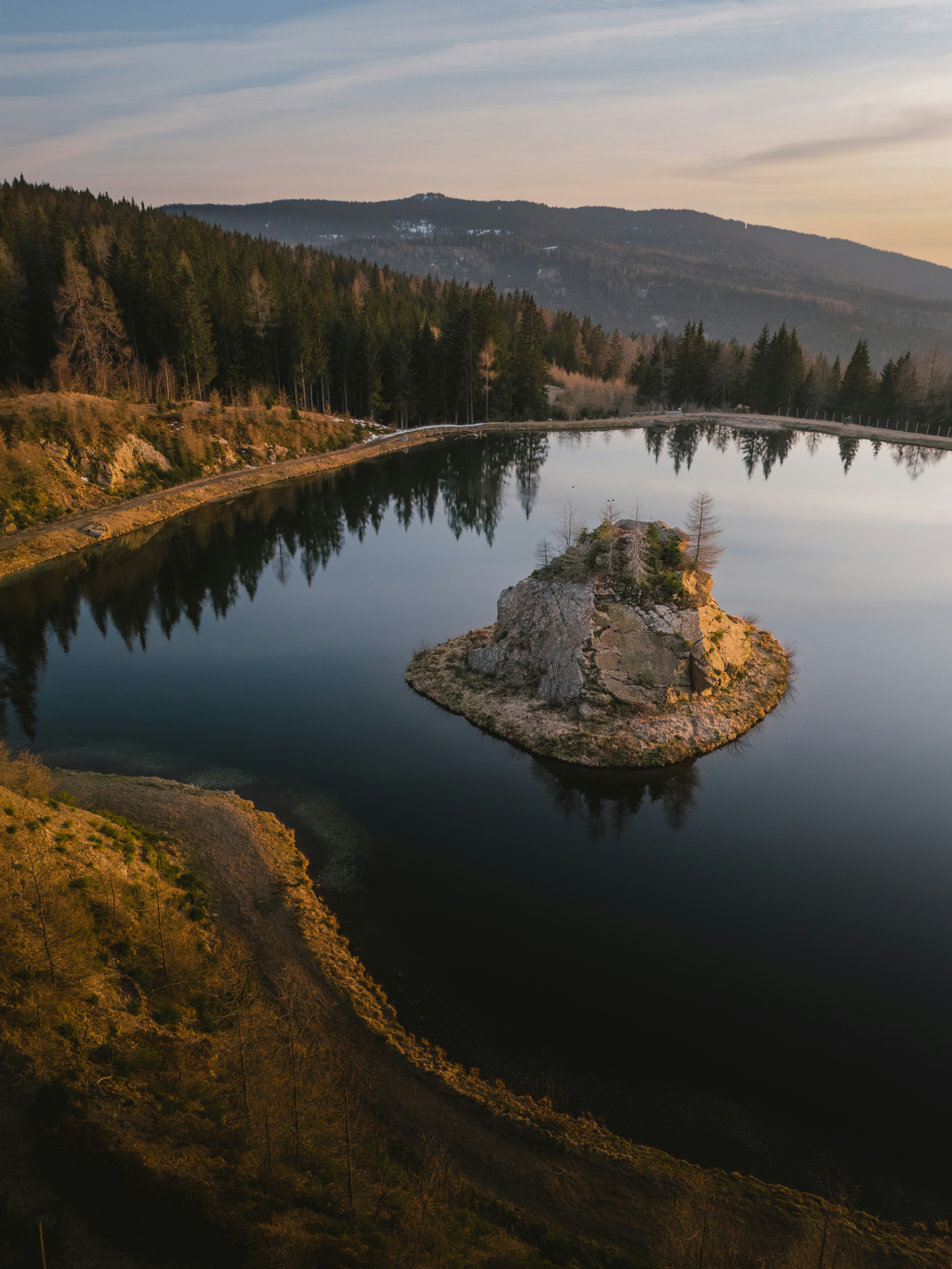 Granite Island at Dusk: A Quiet Ring in a Glassy Lake