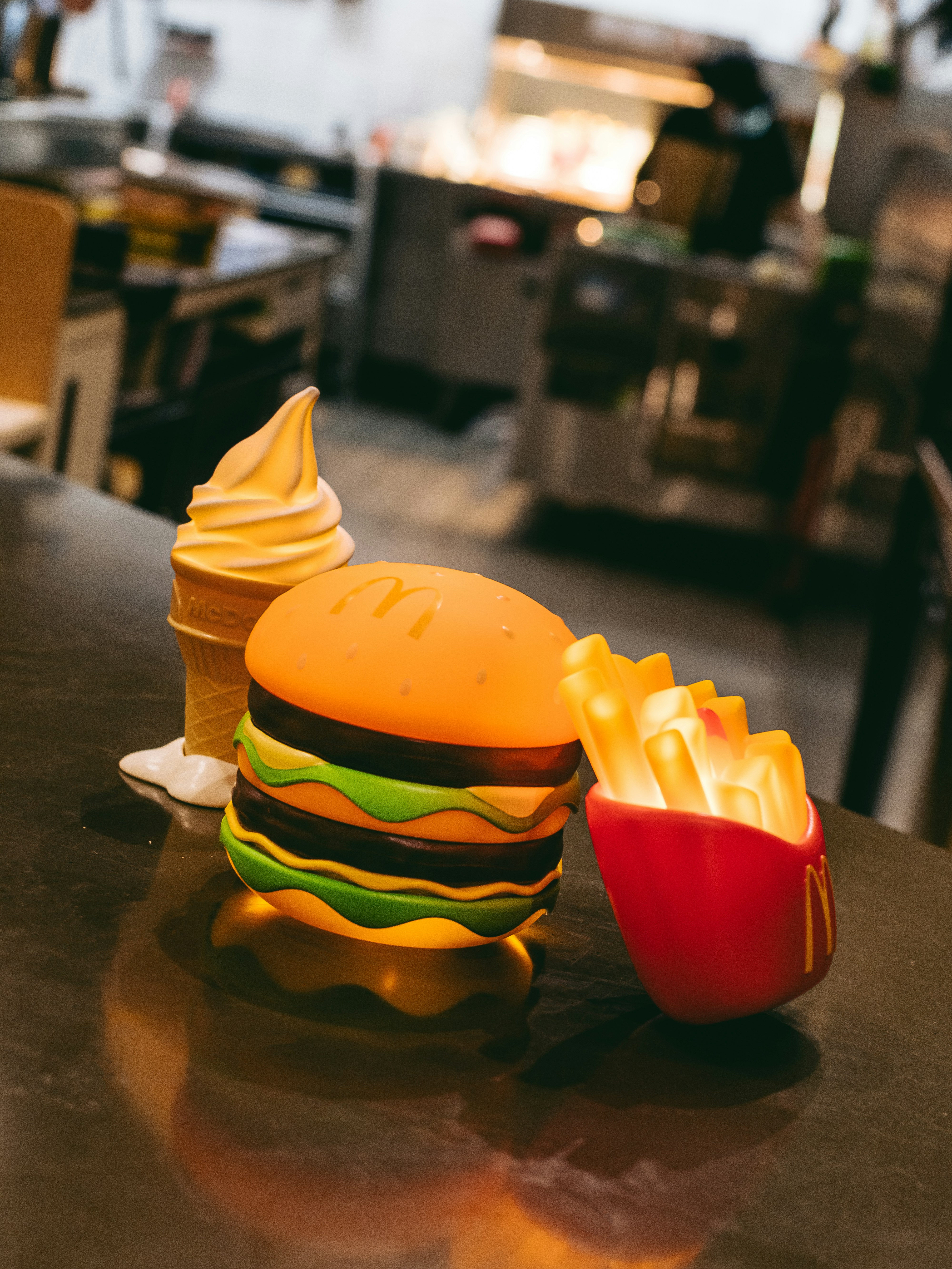 Mcdonald's-themed lights brighten a surface.