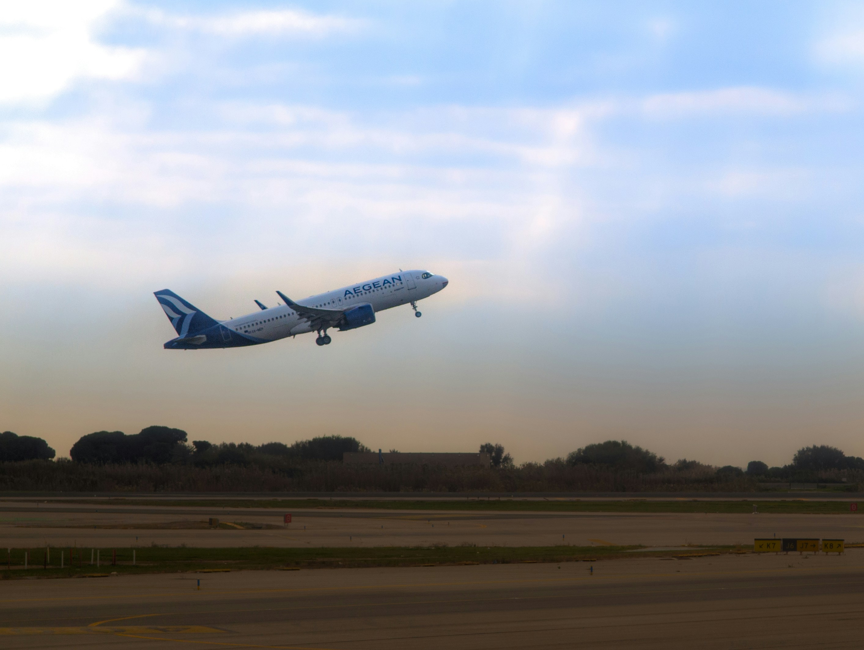 An airplane is taking off into the sky.