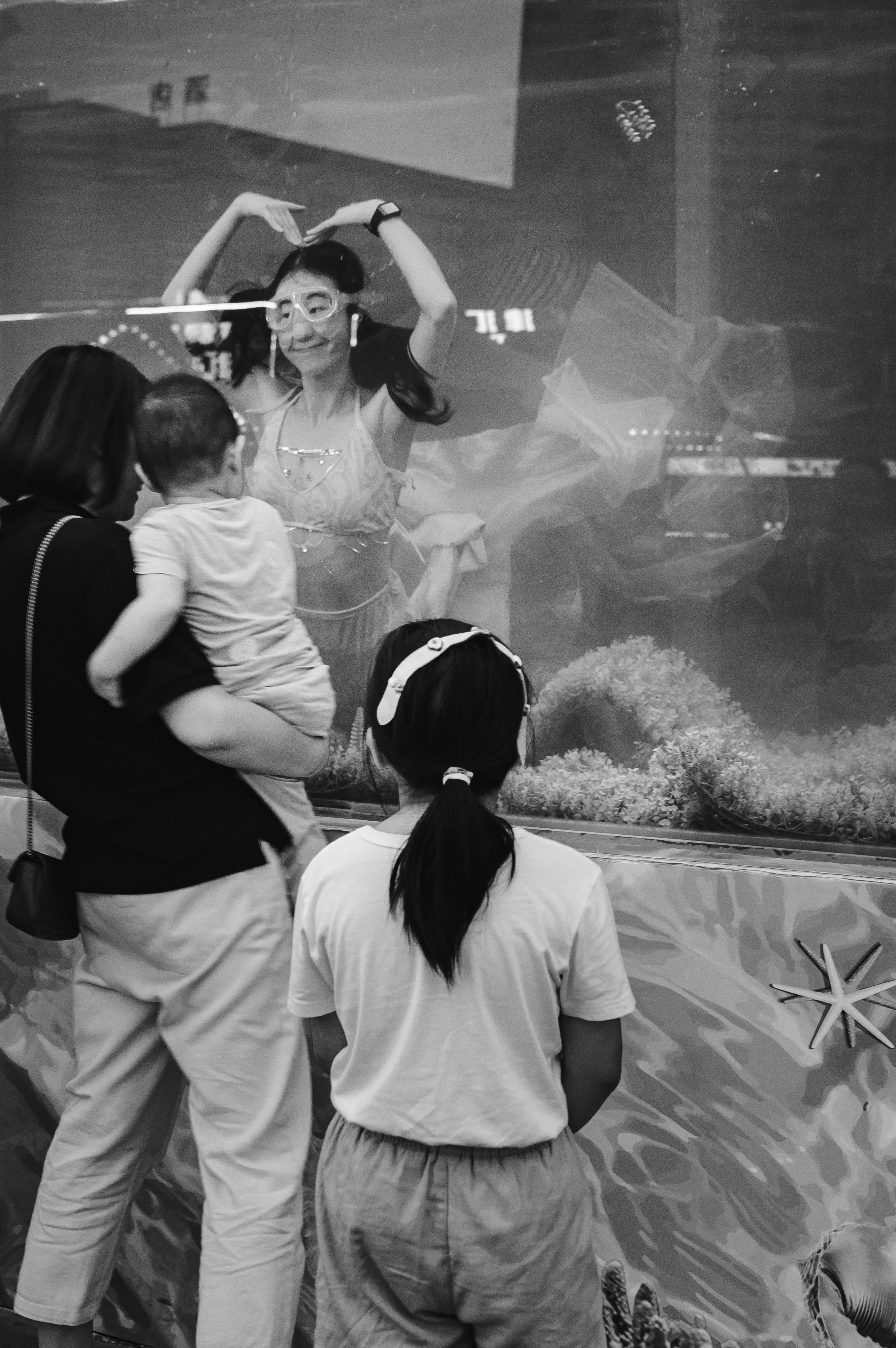 People watch a performer through a window. photo – Free Dance Image on ...