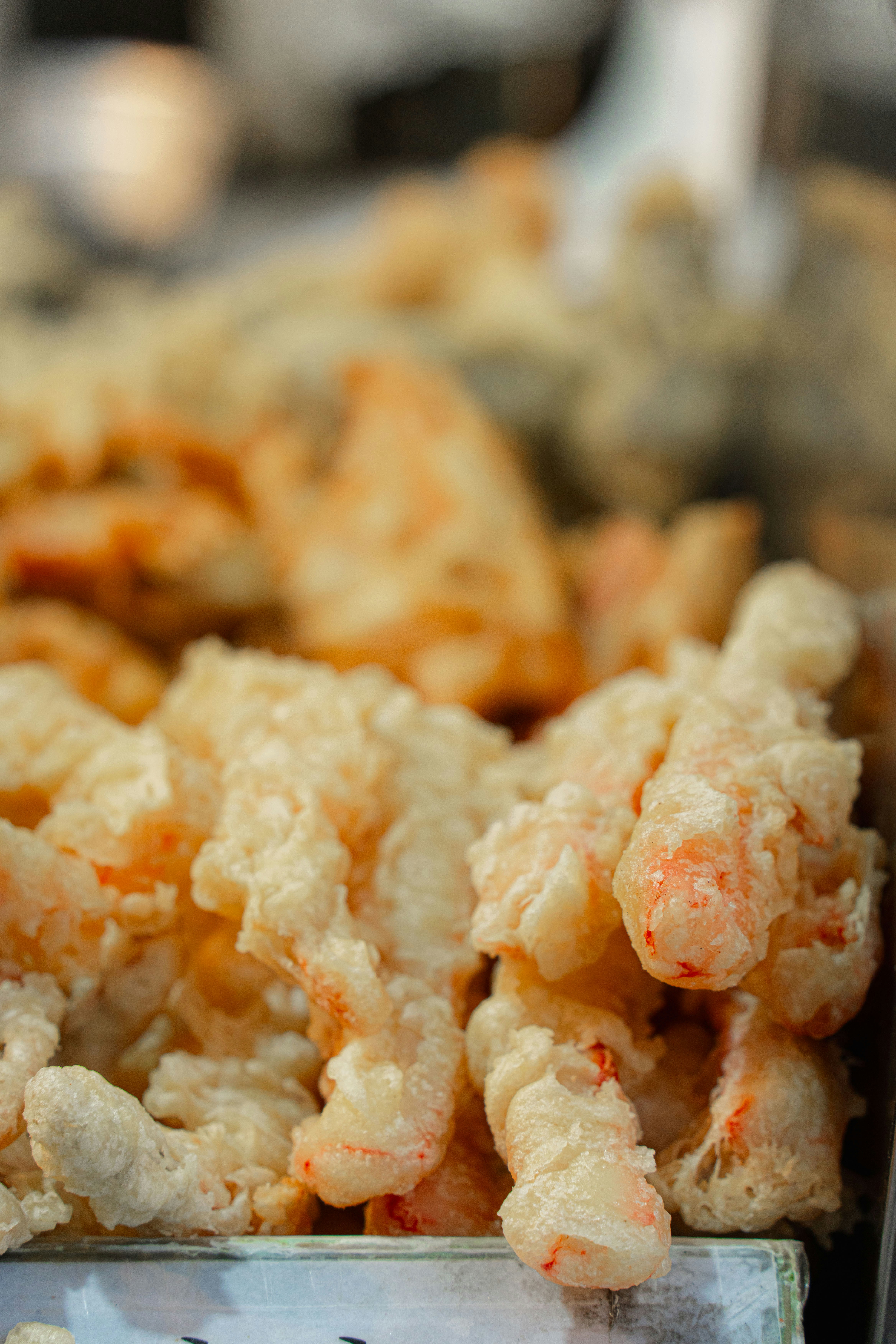 Heap of Golden Tempura Shrimp: Crisp Texture Under Warm Kitchen Light