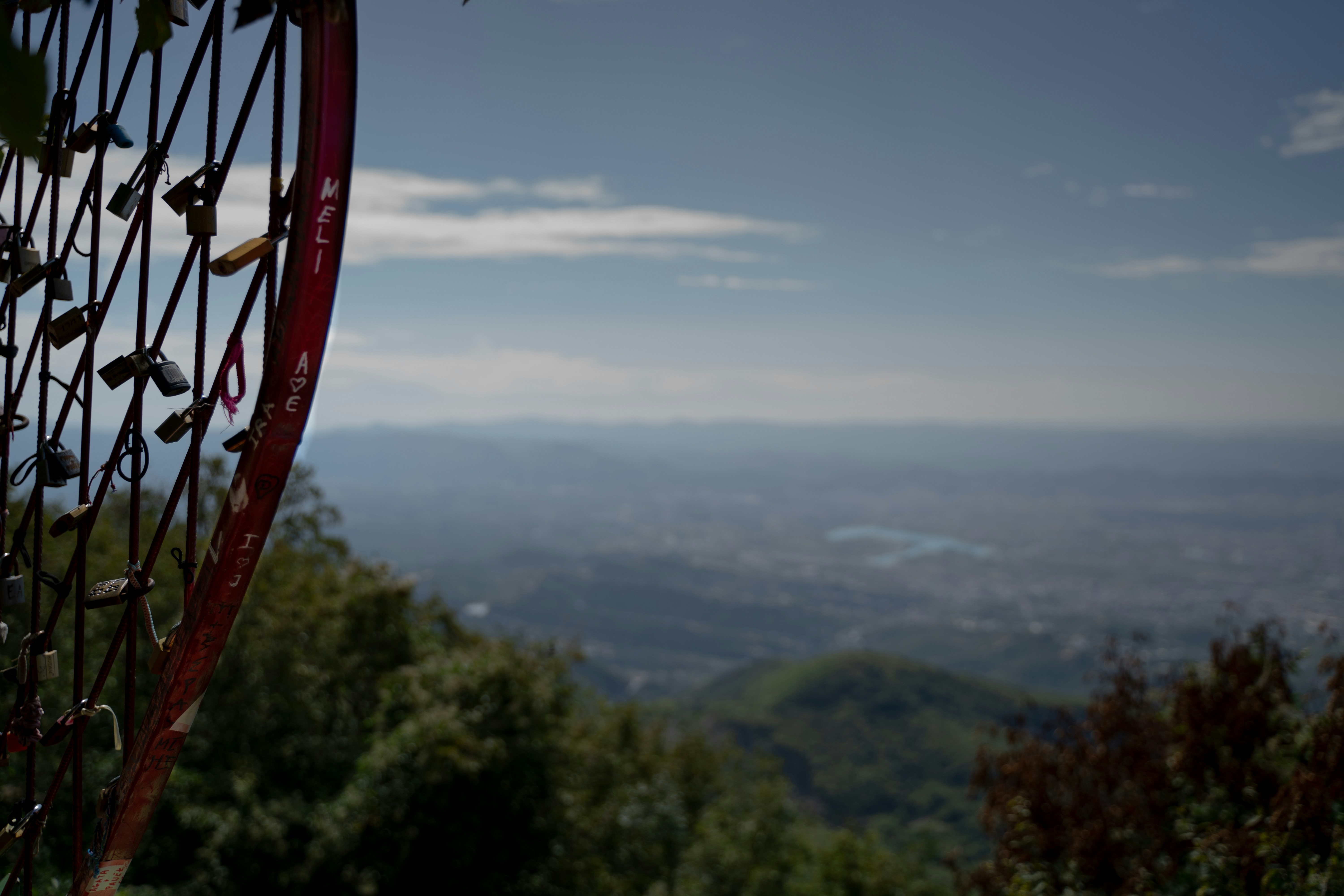 Edge of the Overlook: Frisbee Basket Framing a Distant Valley