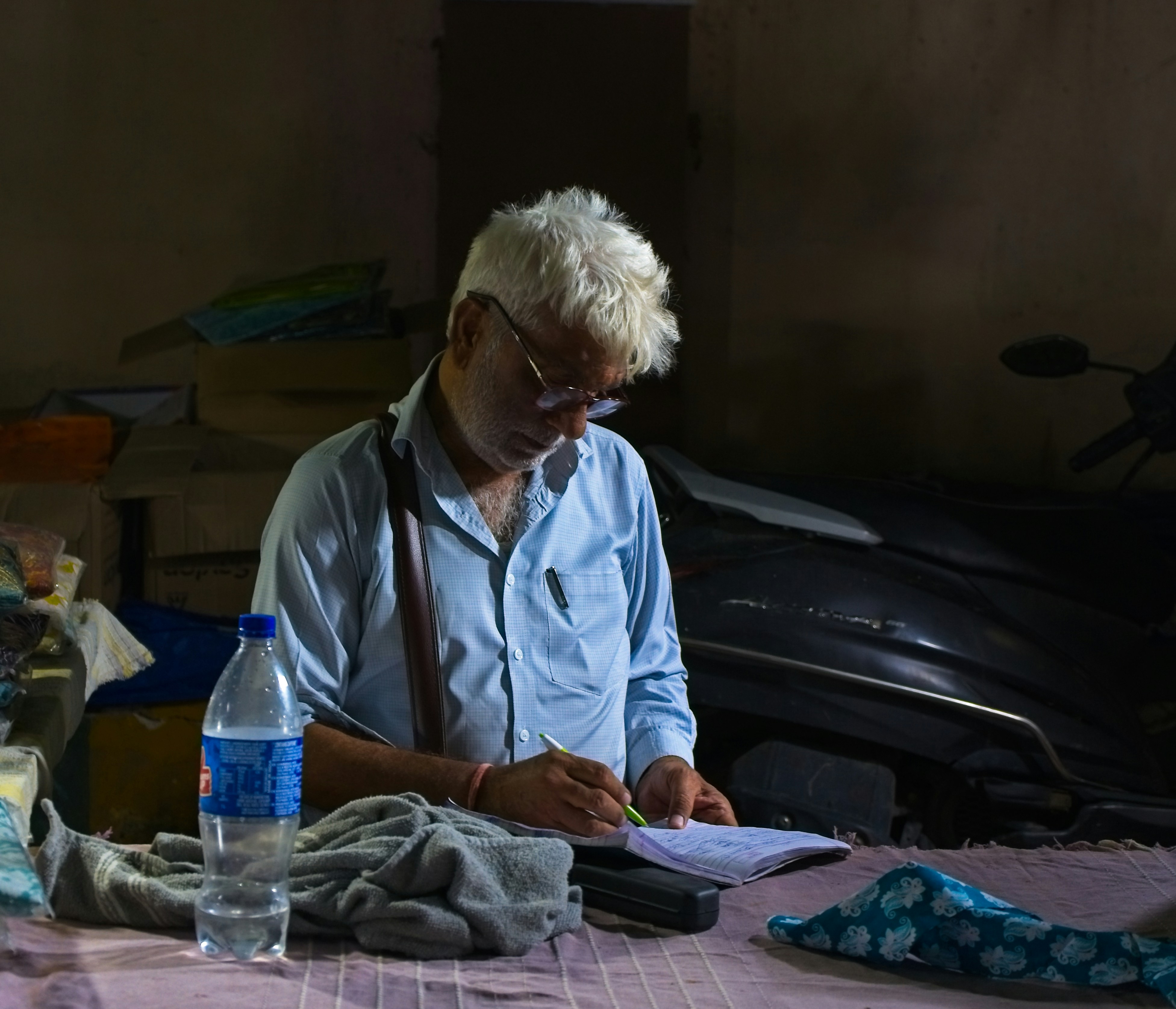 A cloth vendor in the streets of India at night