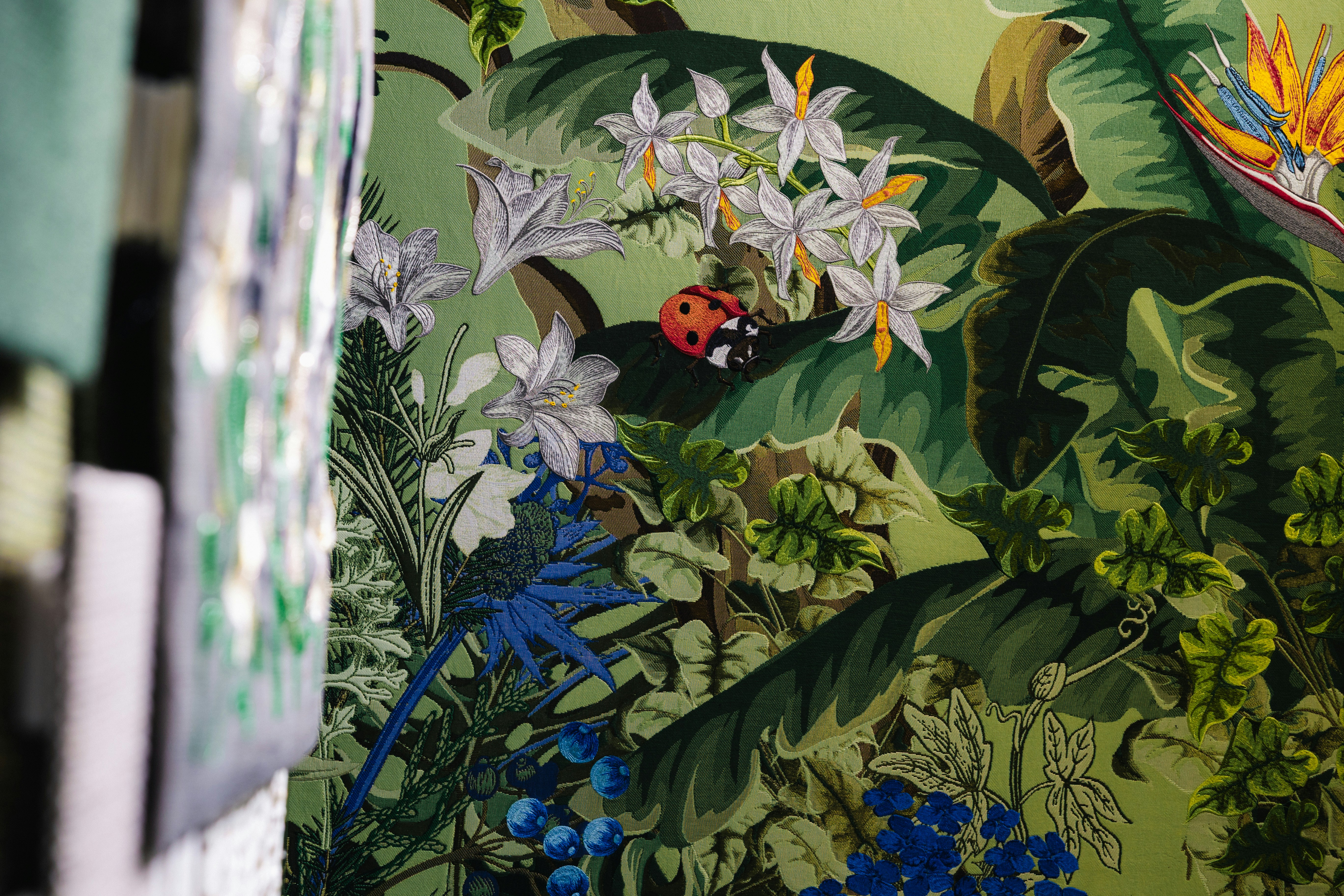 A ladybug rests on a floral patterned mural. photo – Free Flower Image ...