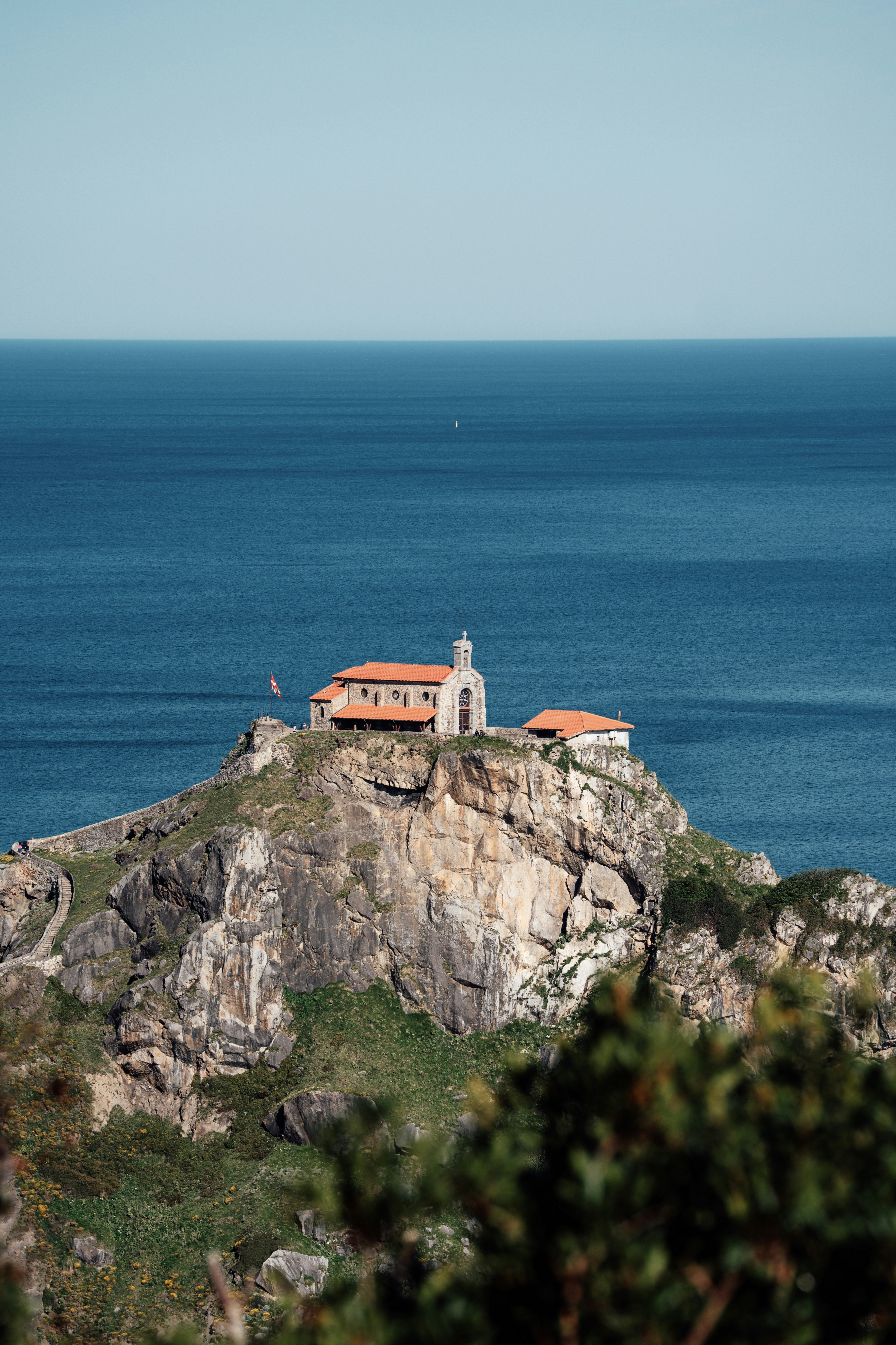 Red-Roofed Sanctuary at the Edge of the Sea