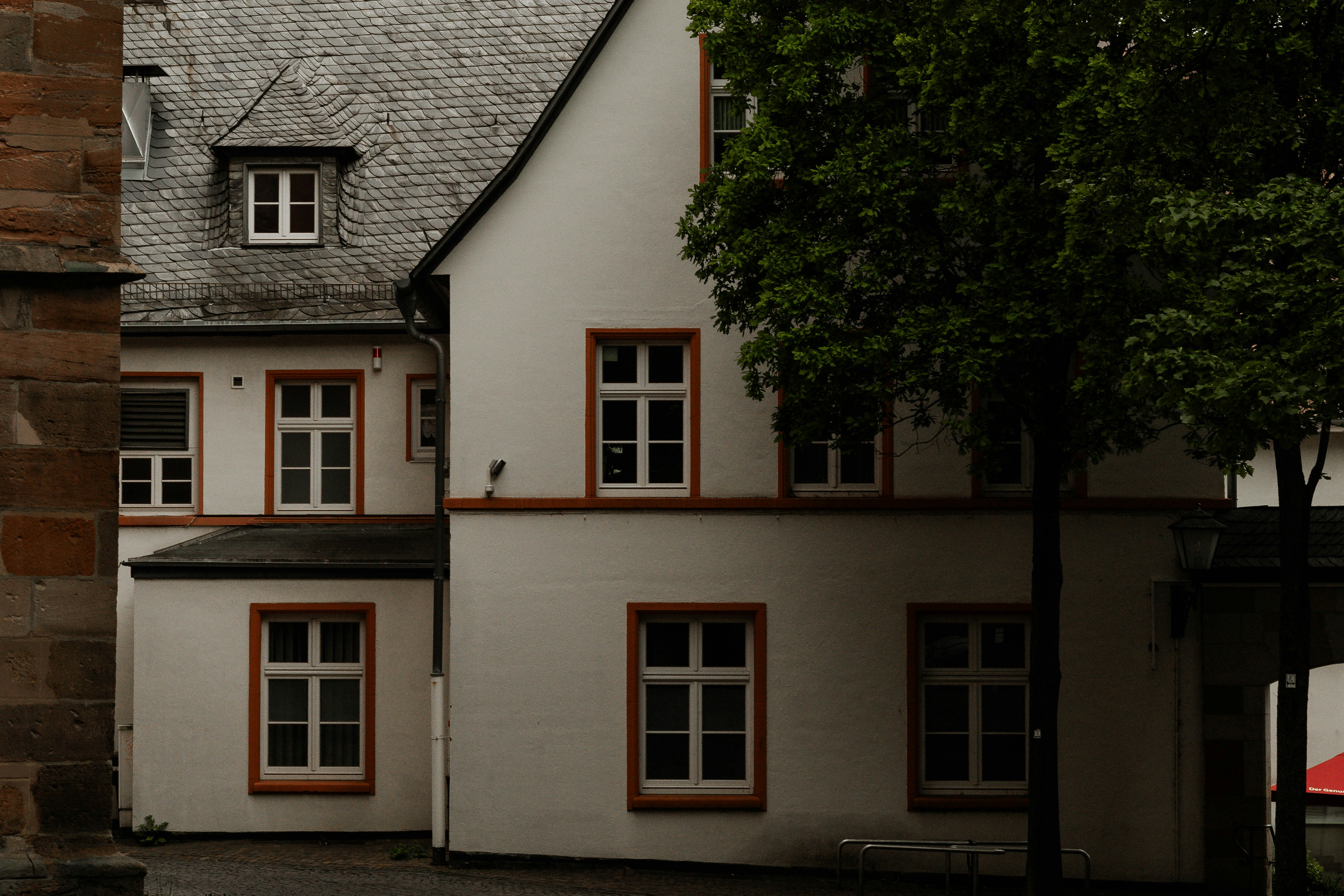 Buildings with red-trimmed windows stand together. photo – Free ...
