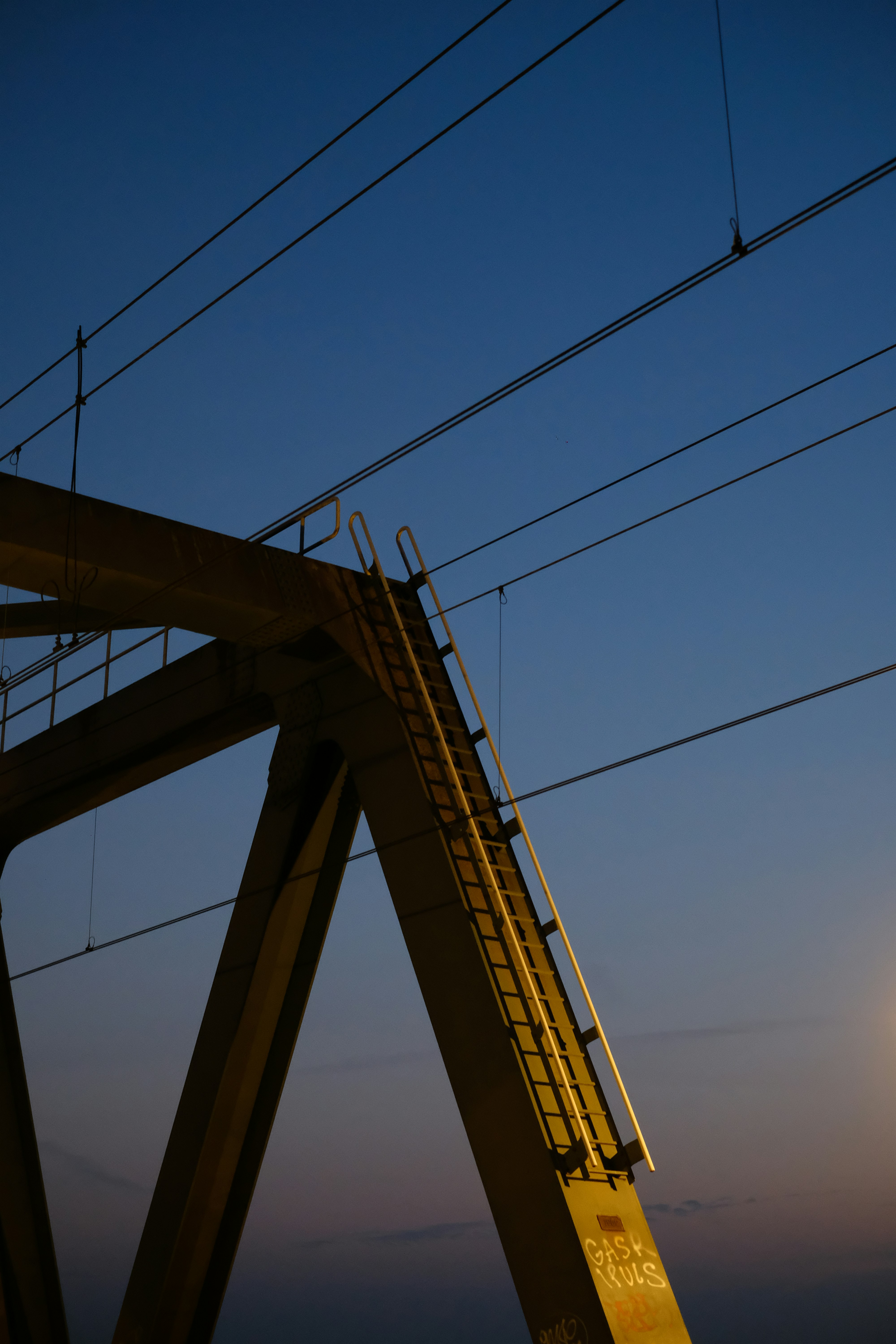 A bridge and ladder against a deep blue sky. photo – Free Sunset Image ...