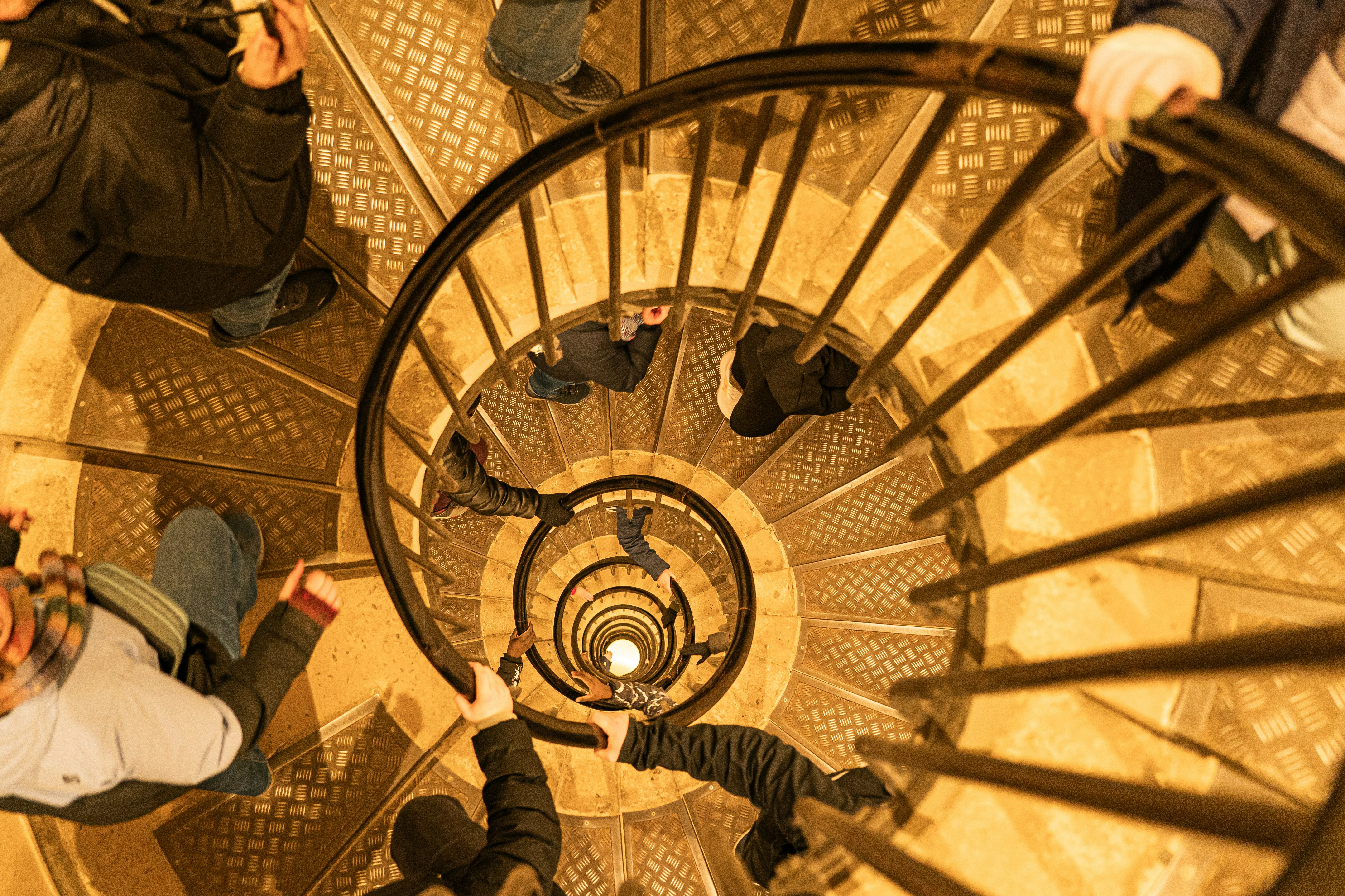 People Ascend A Winding Staircase Photo Free Man Image On Unsplash