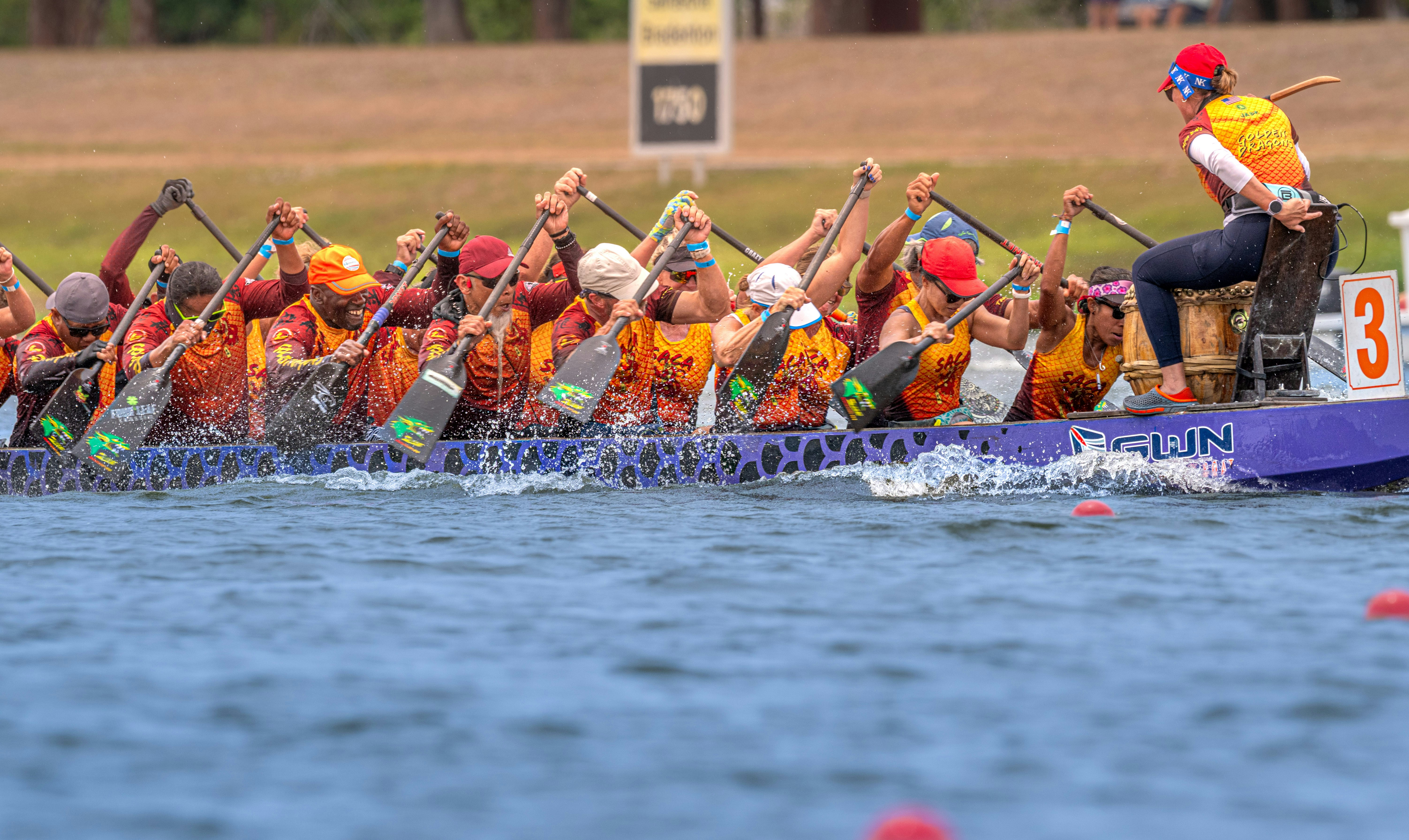 A dragon boat team paddles hard in competition. photo – Free Team Image ...