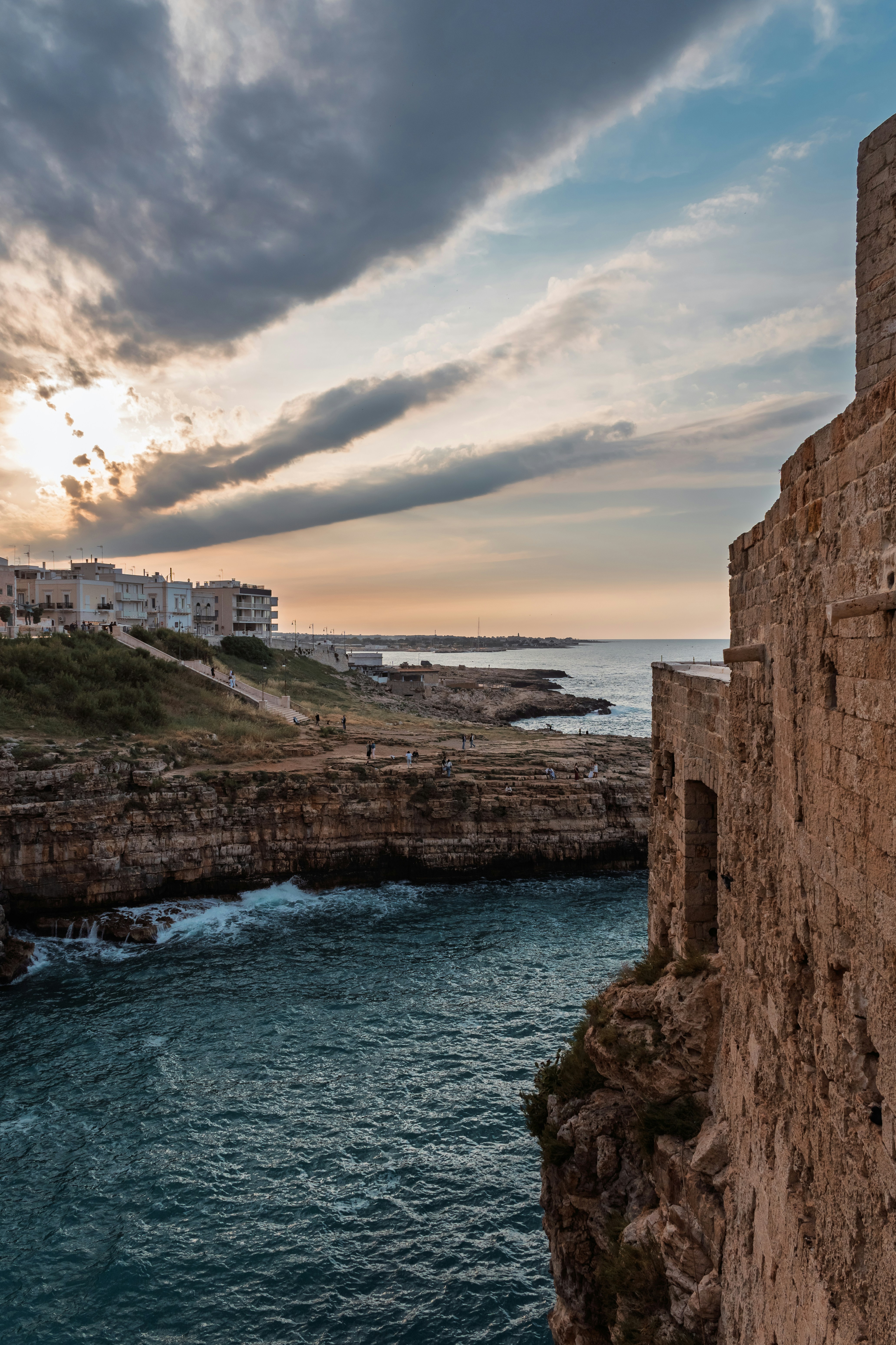 Dusk at the Cliffside Fortress: Weathered Walls Over a Quiet Sea