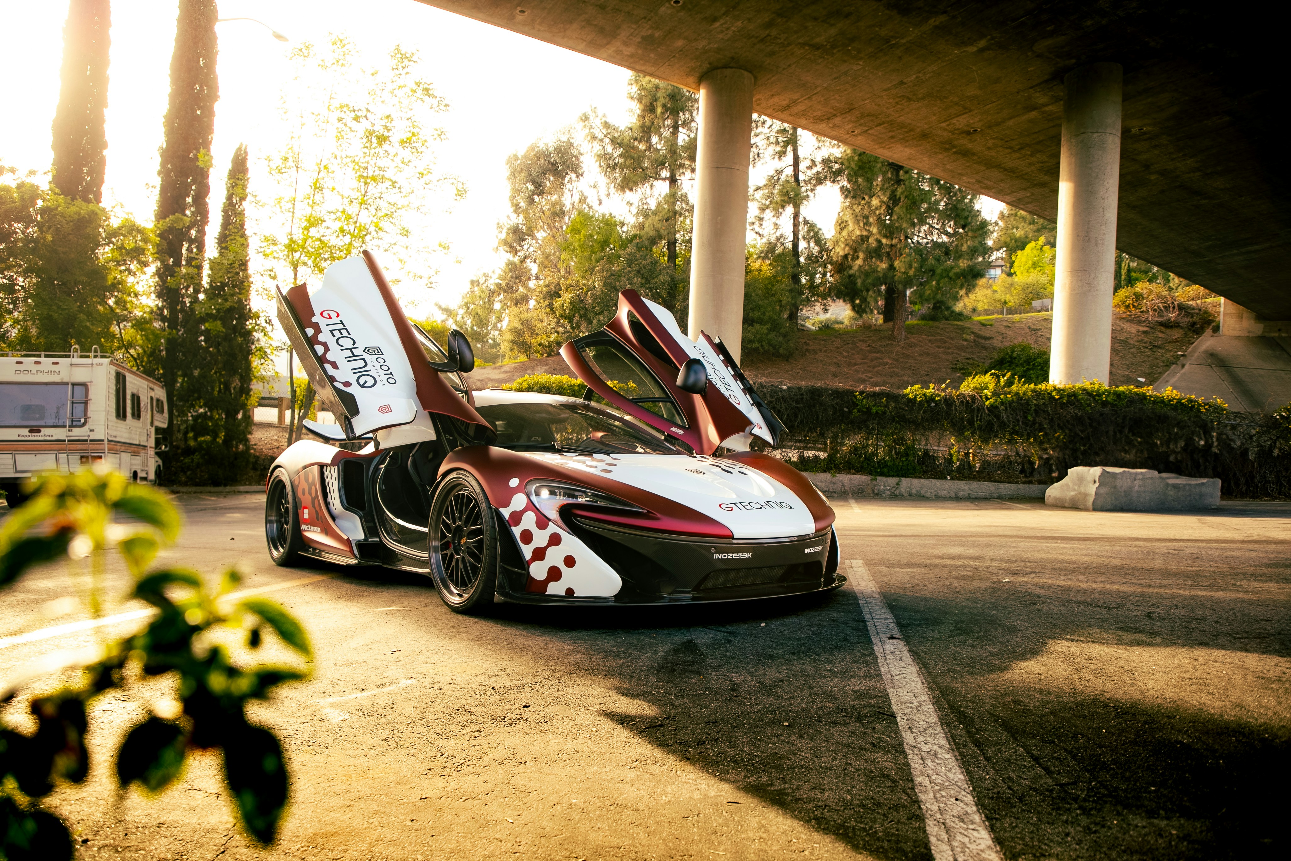 A mclaren sports car with its doors open. photo – Free Car Image on ...