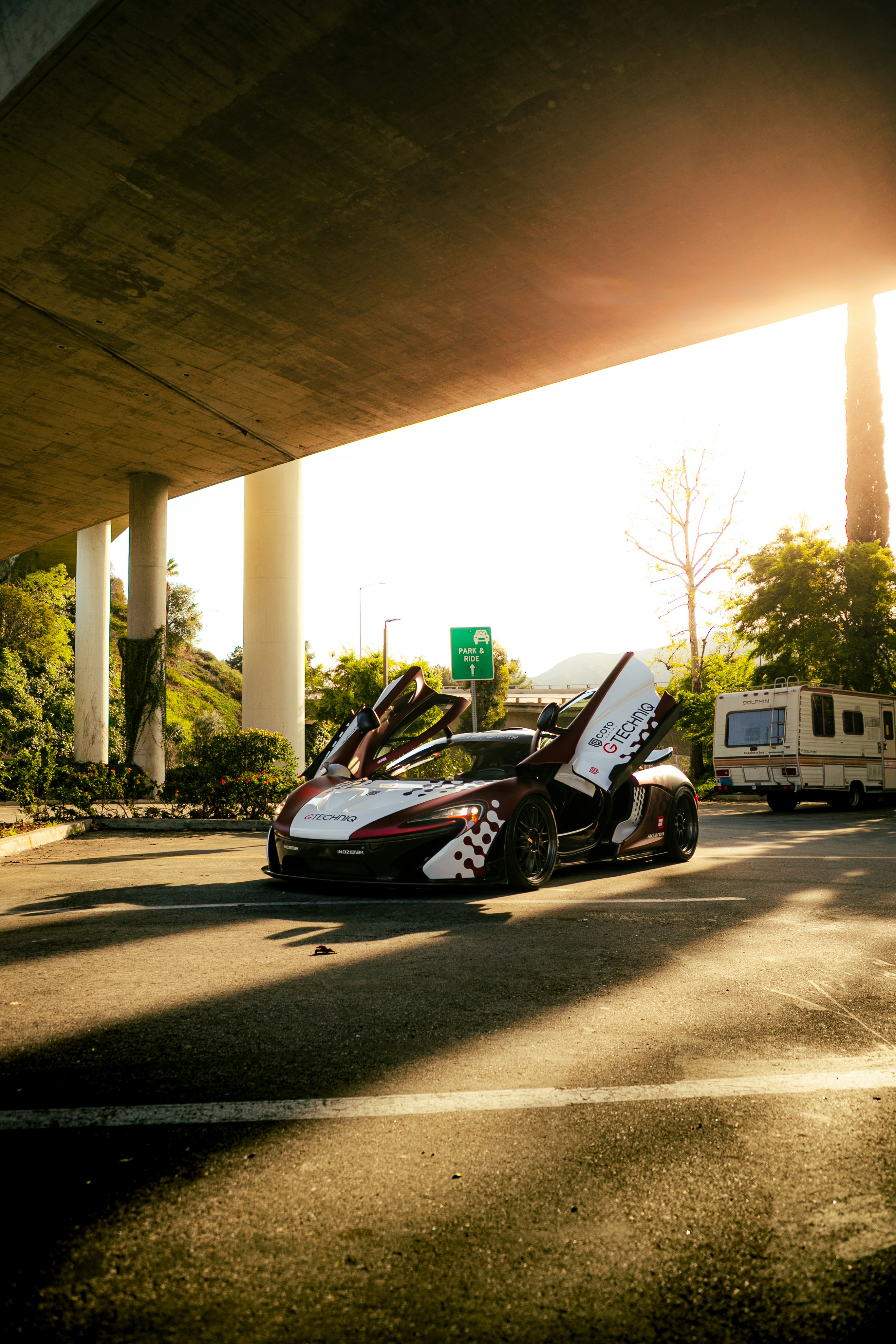 A mclaren supercar with doors open is pictured. photo – Free Car Image ...