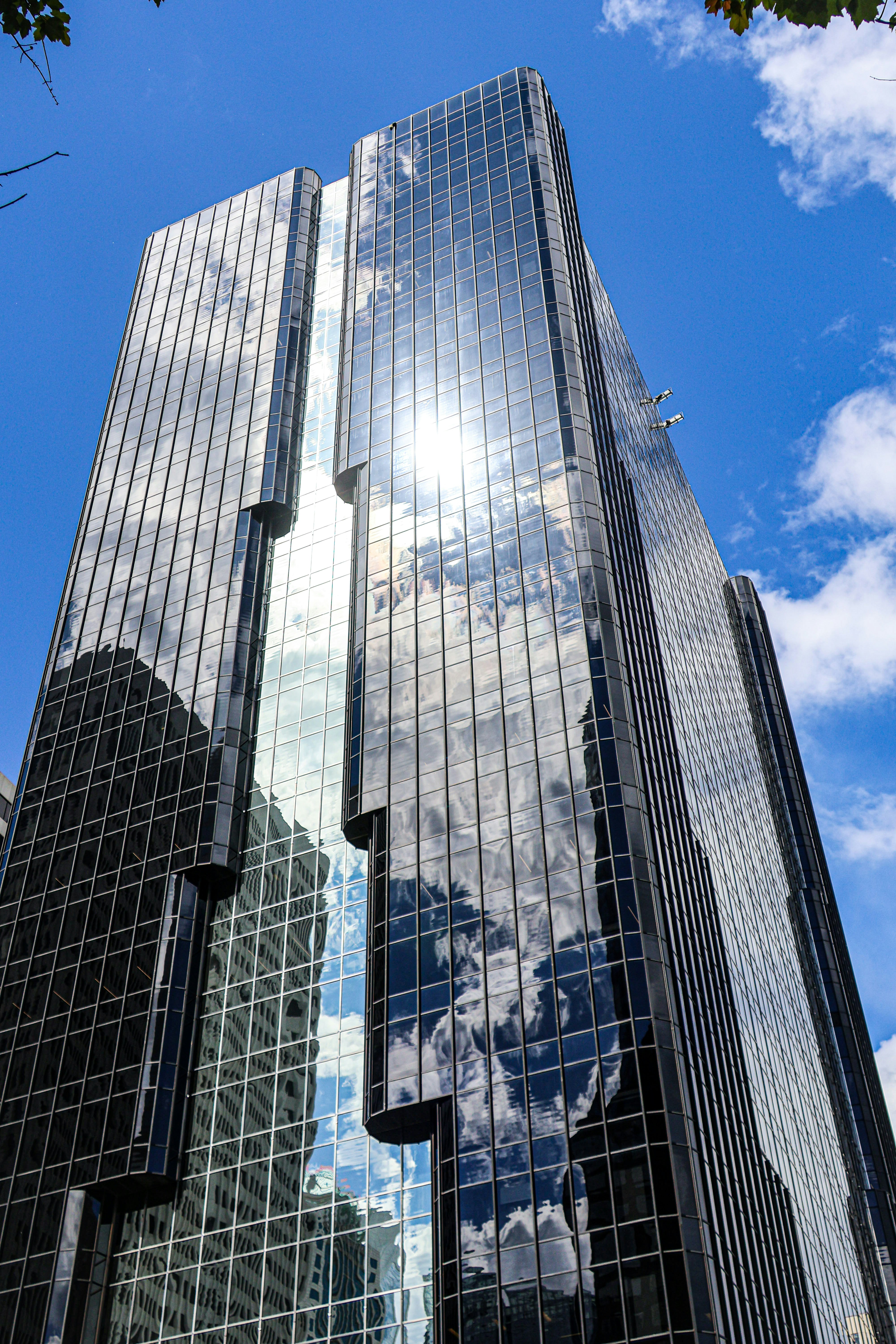 Reflections of Modernity: A Glass Facade's Dialogue with the Sky