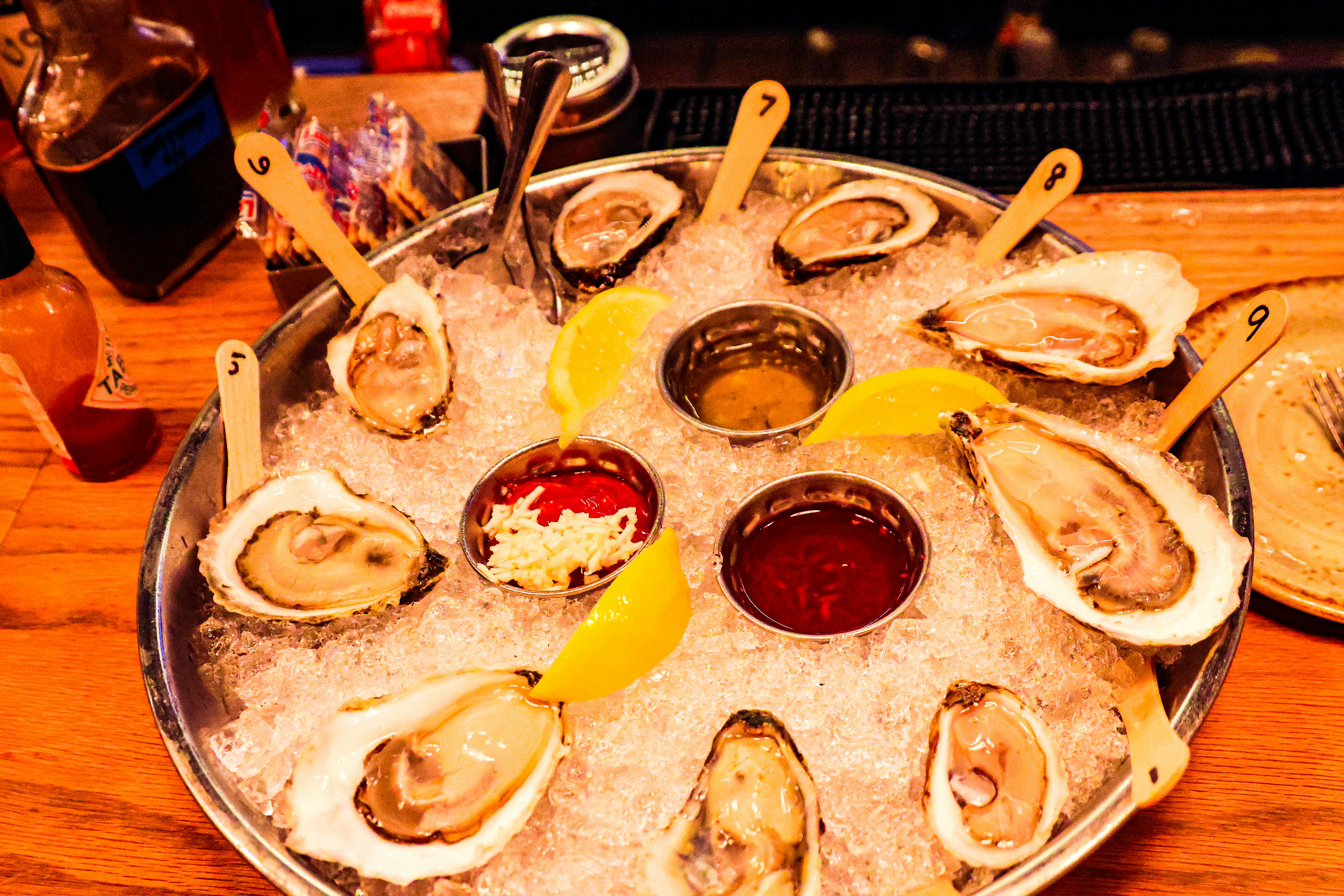 Oysters on Ice: A Circular Bar Spread Framed by Citrus and Sauces
