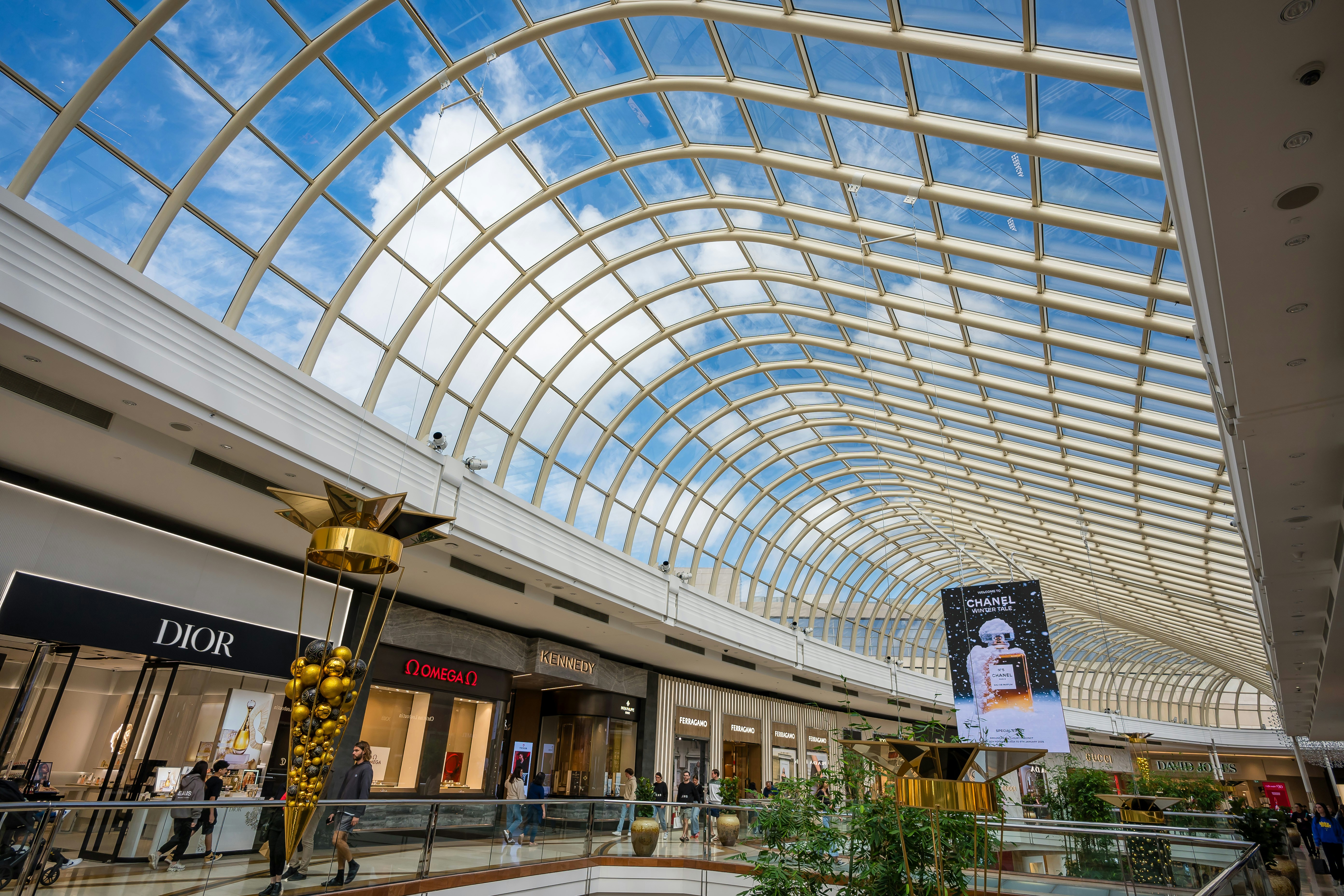 A mall interior features a sky-lit arched ceiling. photo – Free ...