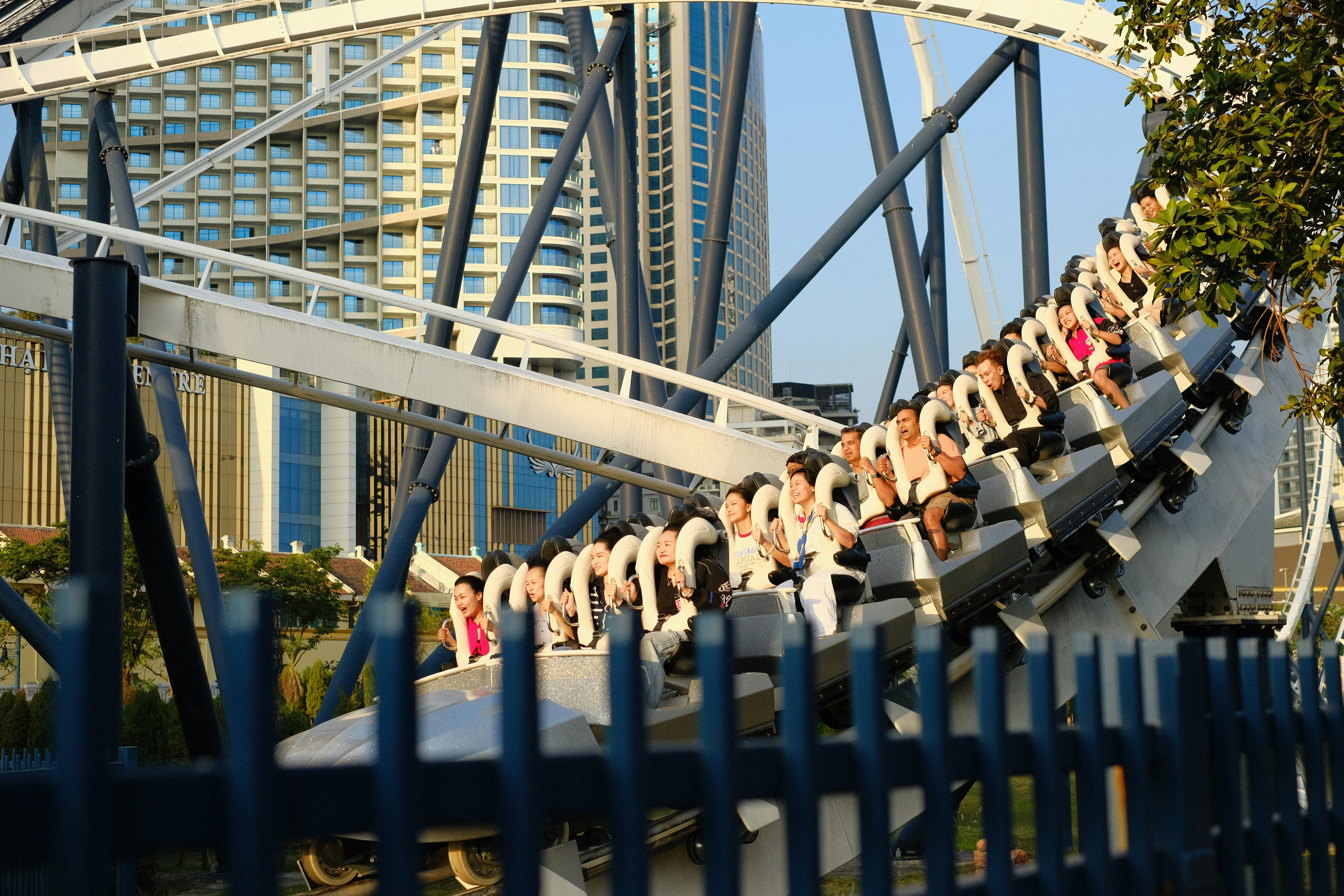 Sunlit Serpent on Steel: Riders Thread a Cityscape