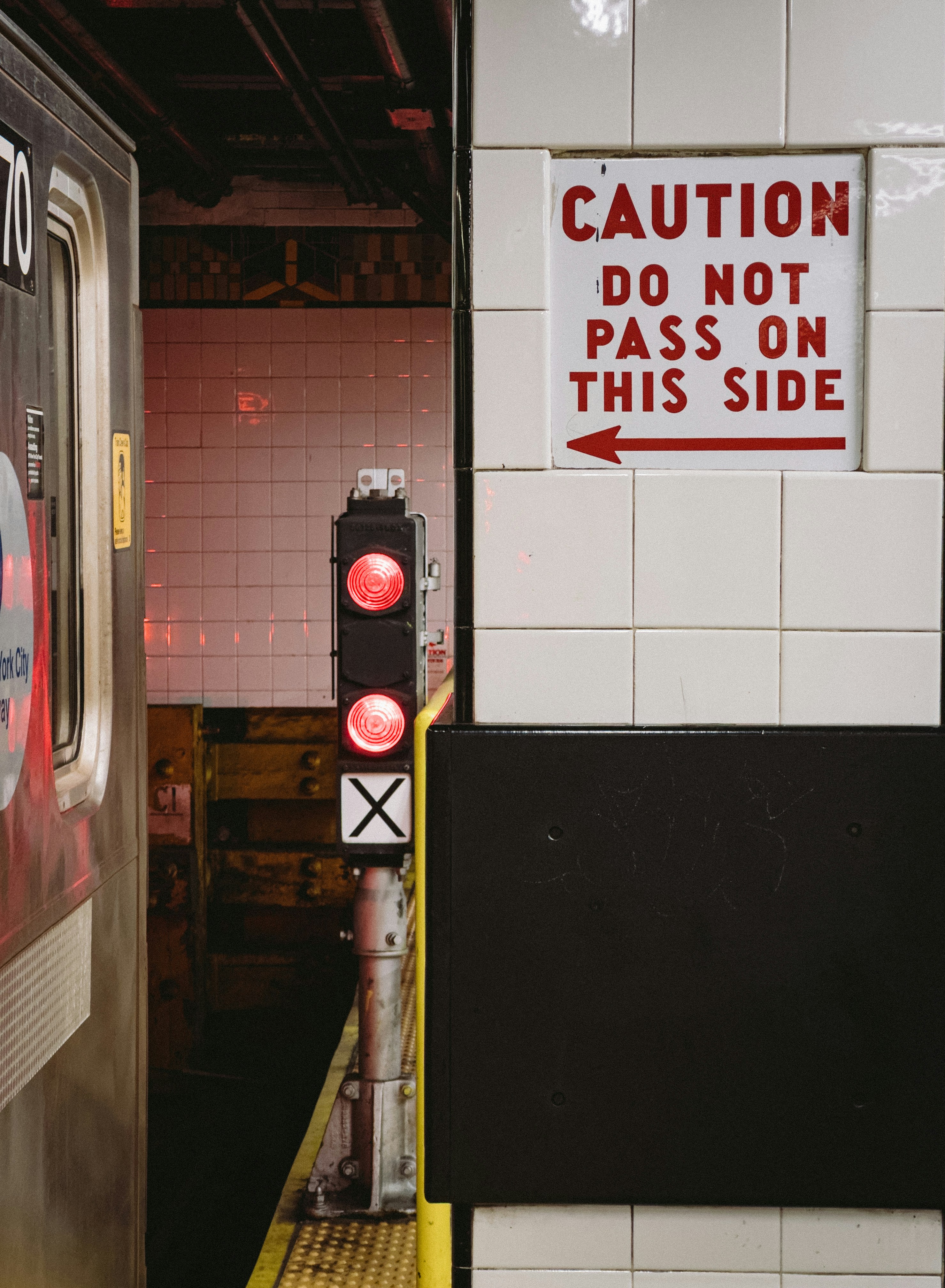 A subway platform with warning lights and sign. photo – Free Symbol ...