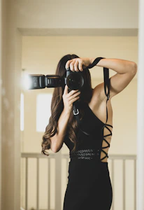Velvet Echo: Lace-Back Dress Framed by a Pro Camera in a Mirror Selfie
