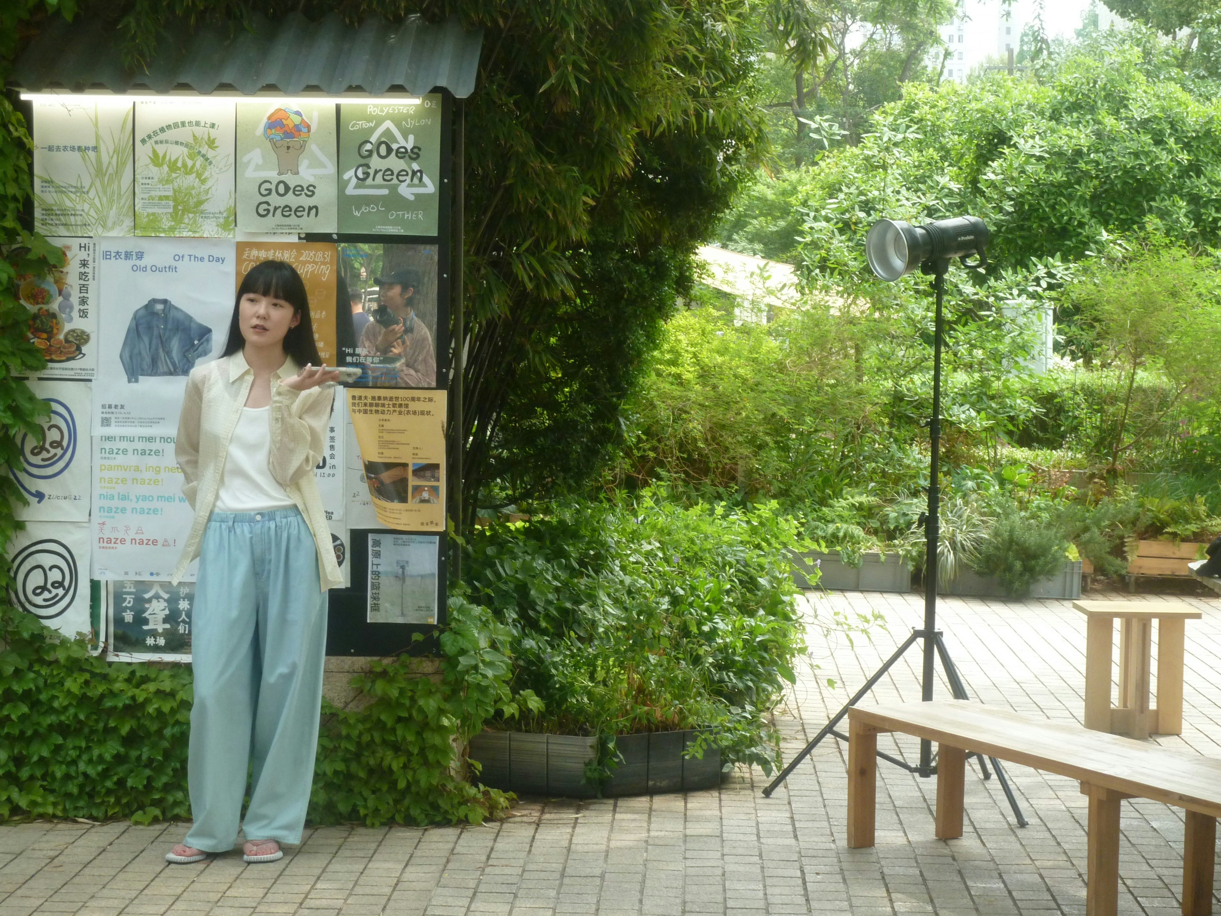 A woman stands near an outdoor photo setup. photo – Free Fashion Image ...
