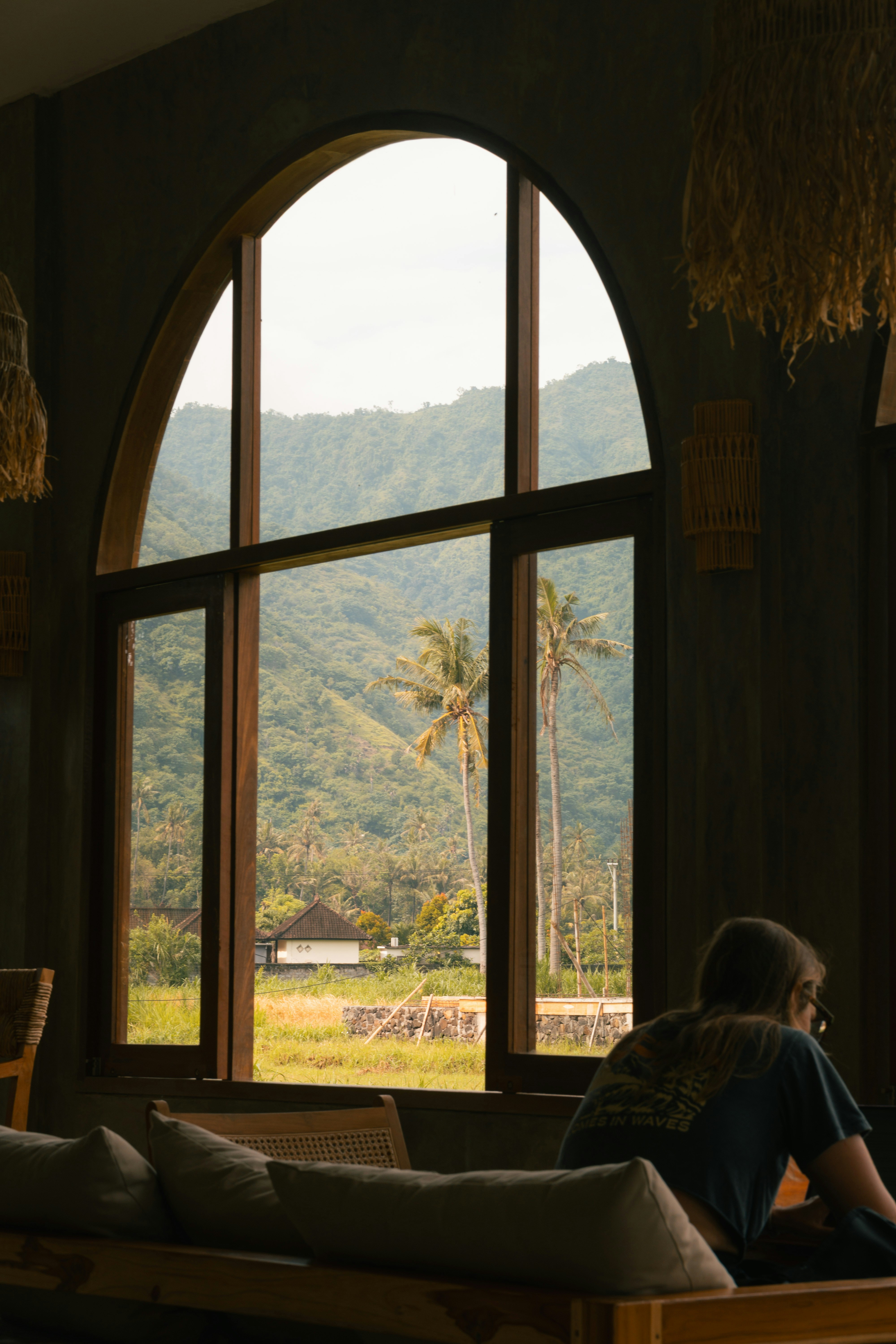 Sunlit Window Frame Merges with Mountain Horizon