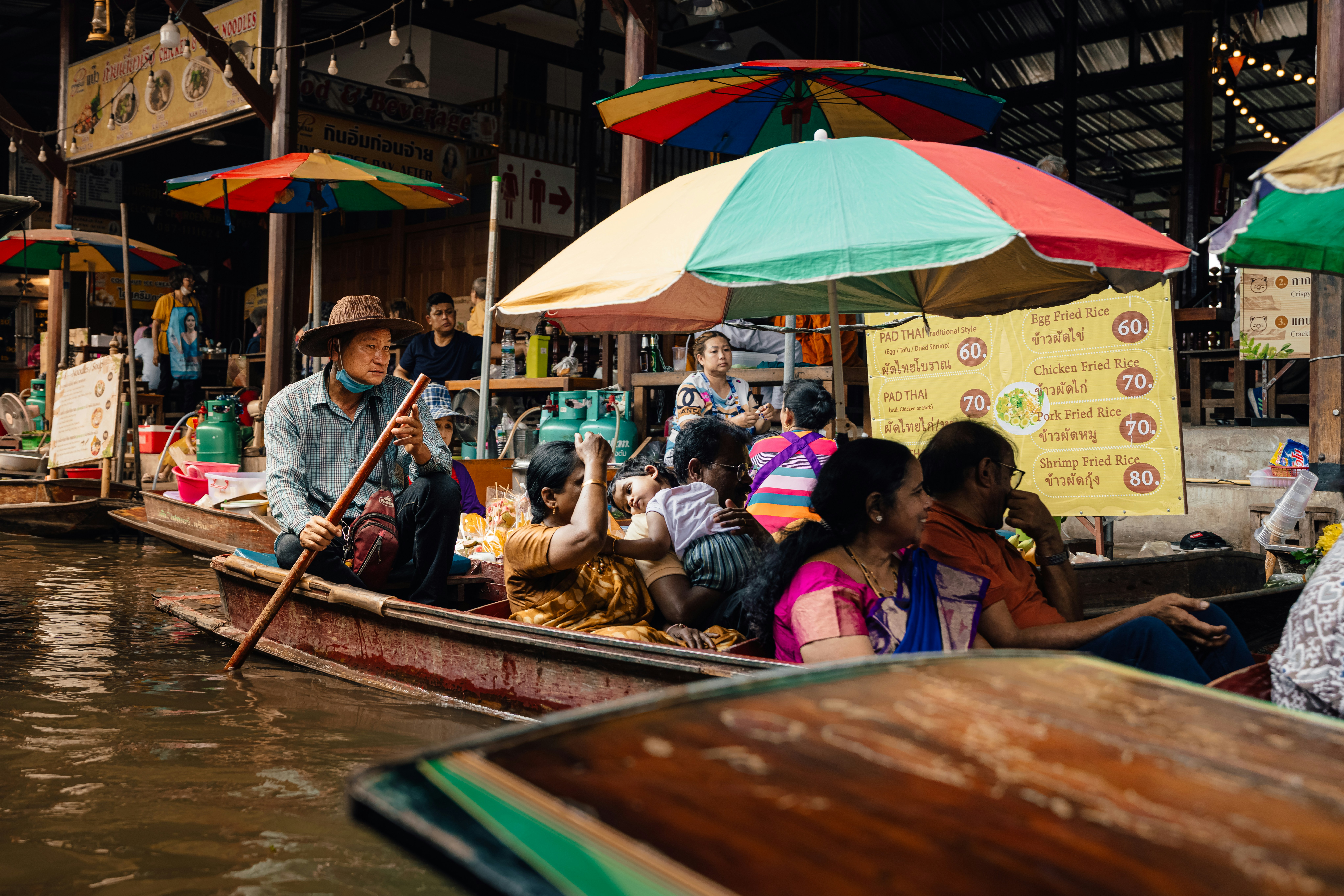 Floating market with vendors and customers in boats. photo – Free ...